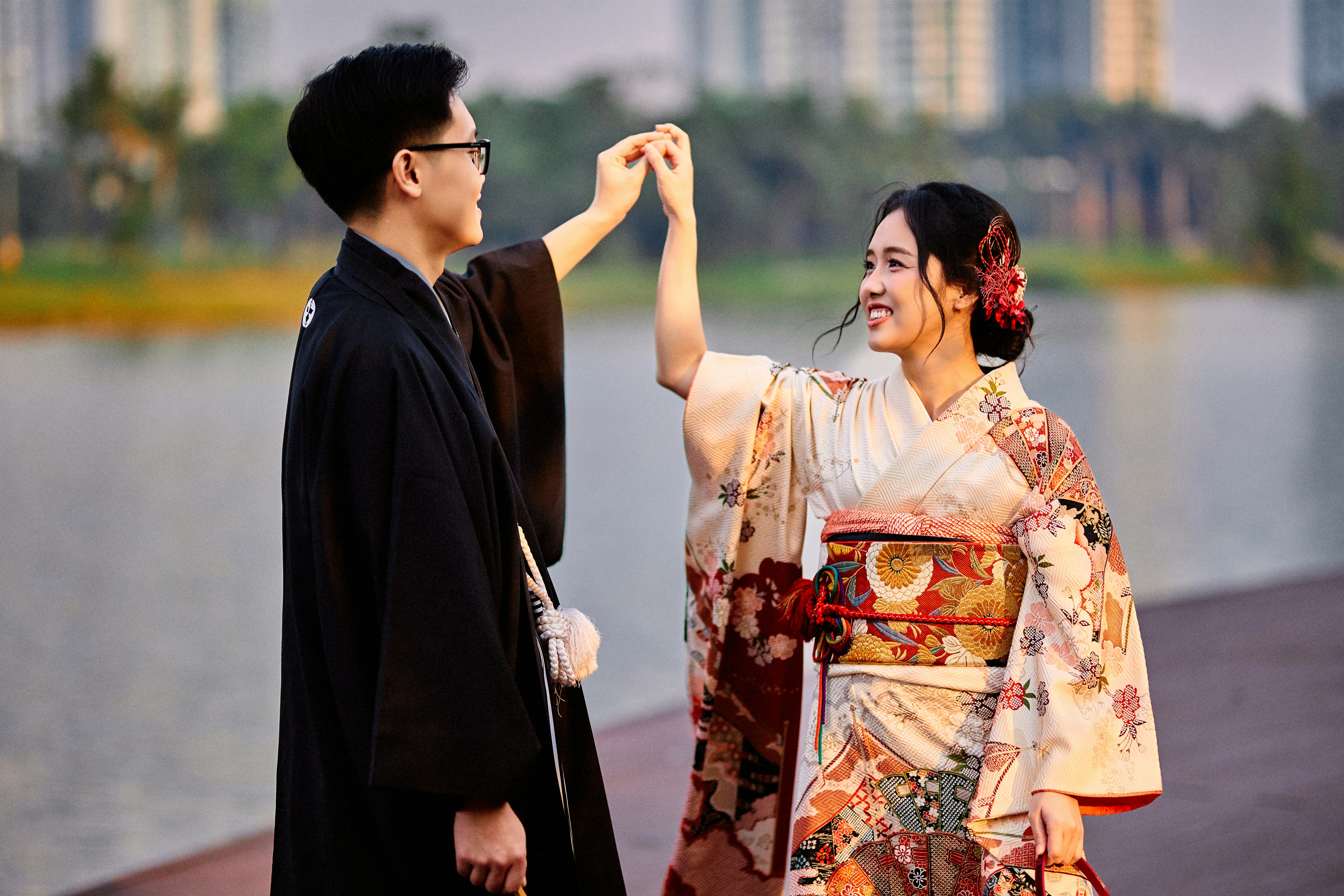 Bridal Tanabata: Two Figures in Traditional Attire Sharing a Moment by the River