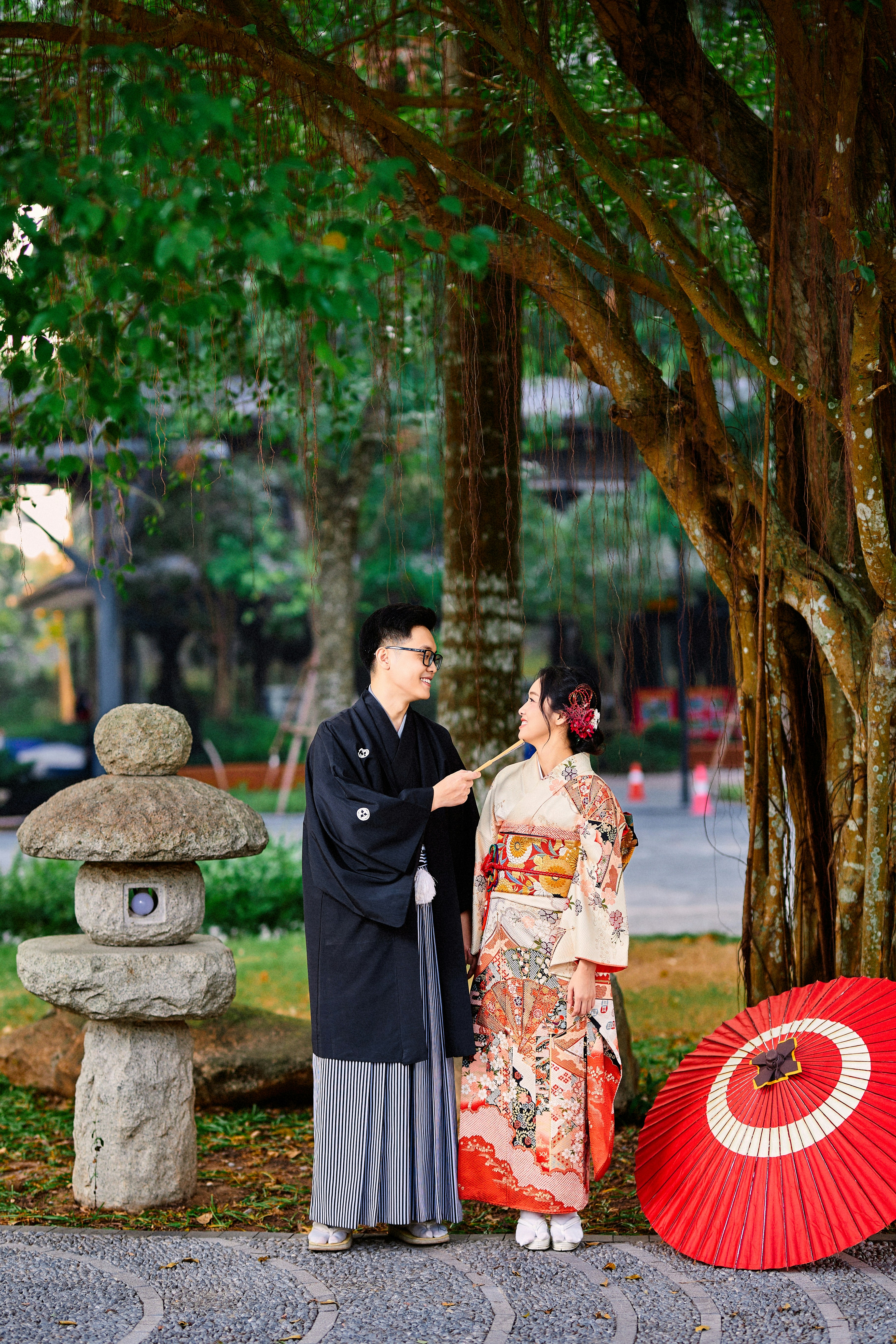 A joyful couple sharing a tender moment, smiling warmly at each other while taking a stroll outdoors. The image radiates genuine happiness, commitment, and the beautiful milestone of a long-lasting relationship.