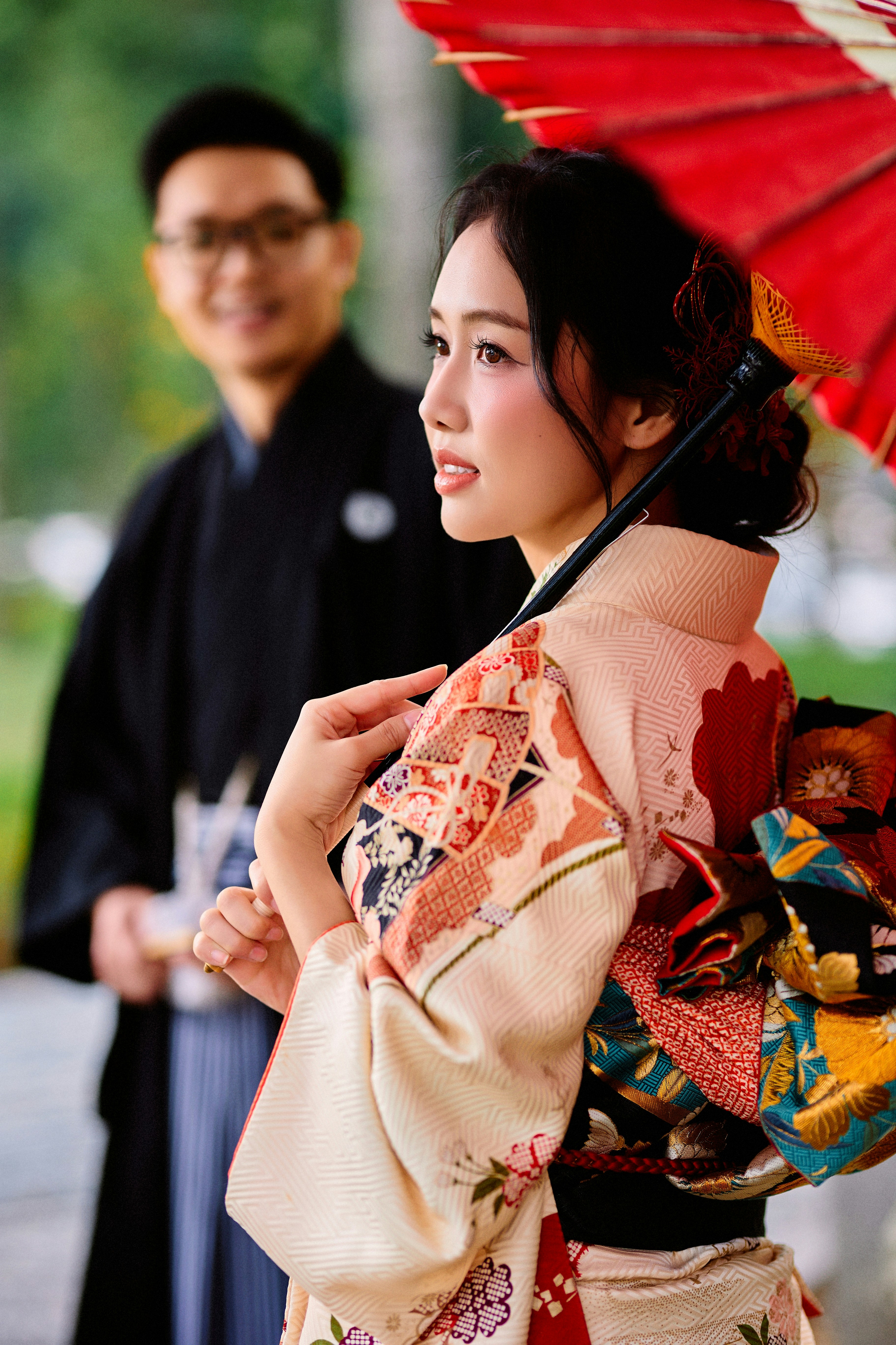 Grace in Silk: A Quiet Moment Under a Red Umbrella