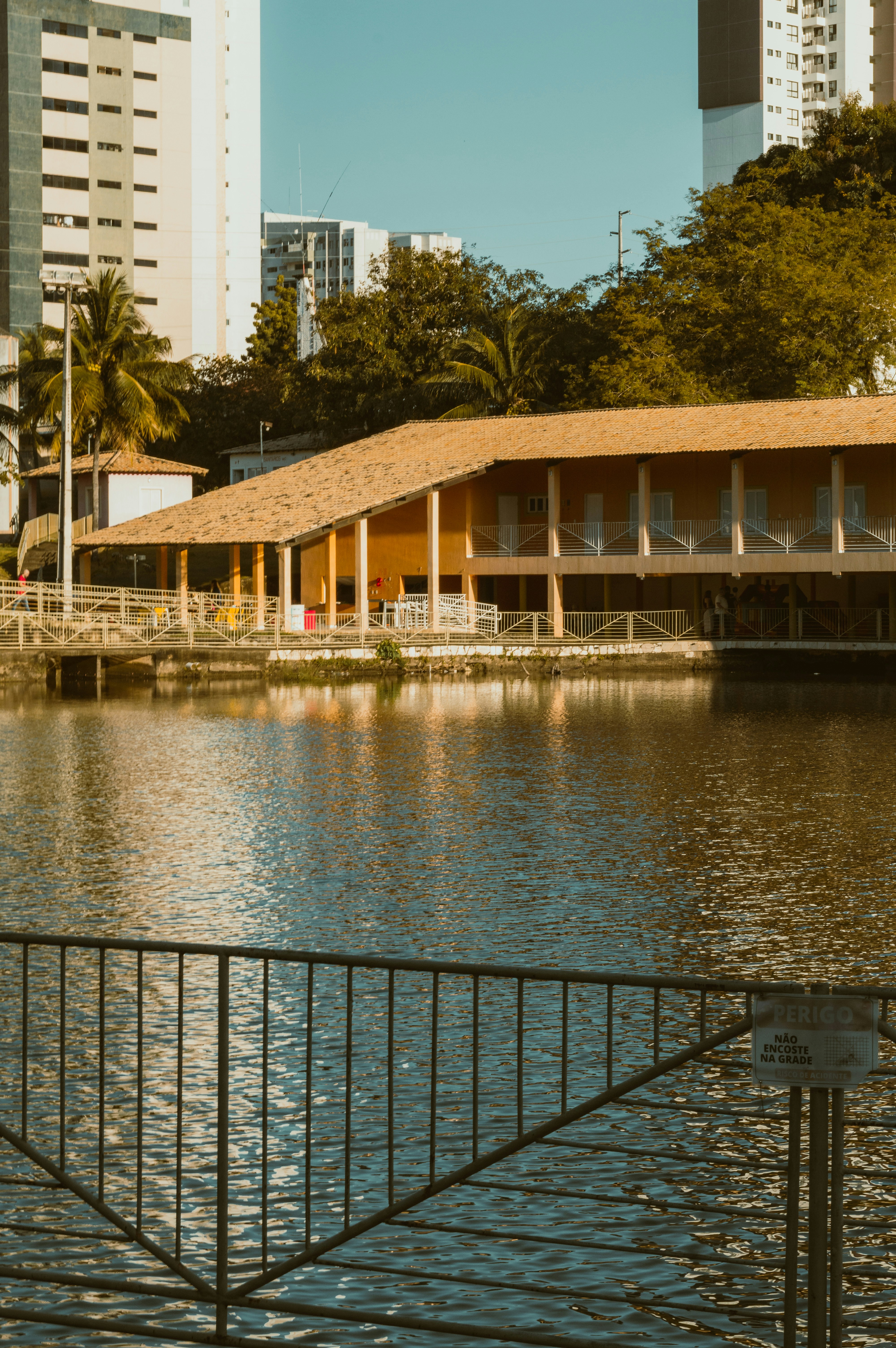 Sunlit waterfront hotel by the city lake