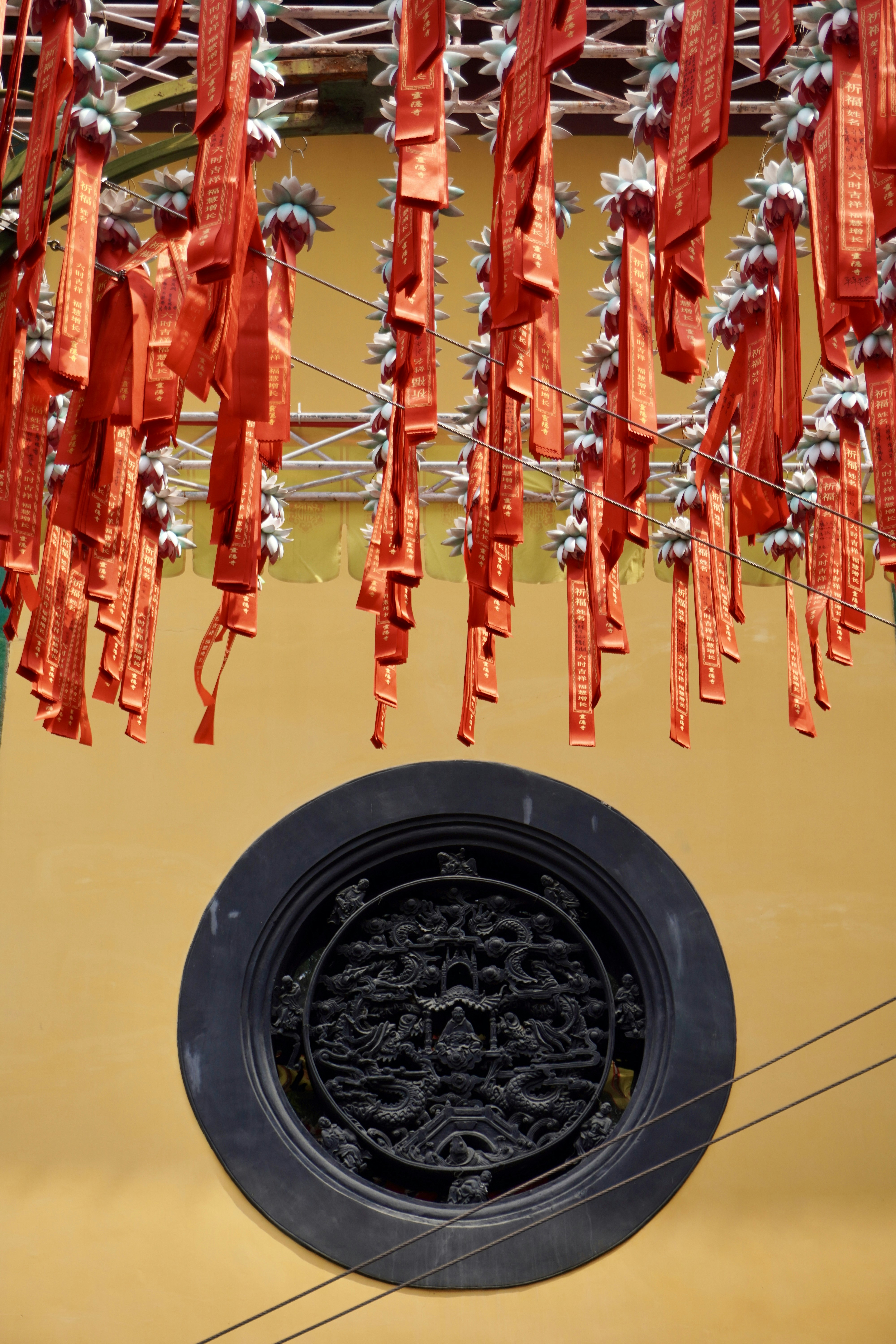 Red Ribbons Over Gold: A Sacred Circle Framed by Ornaments