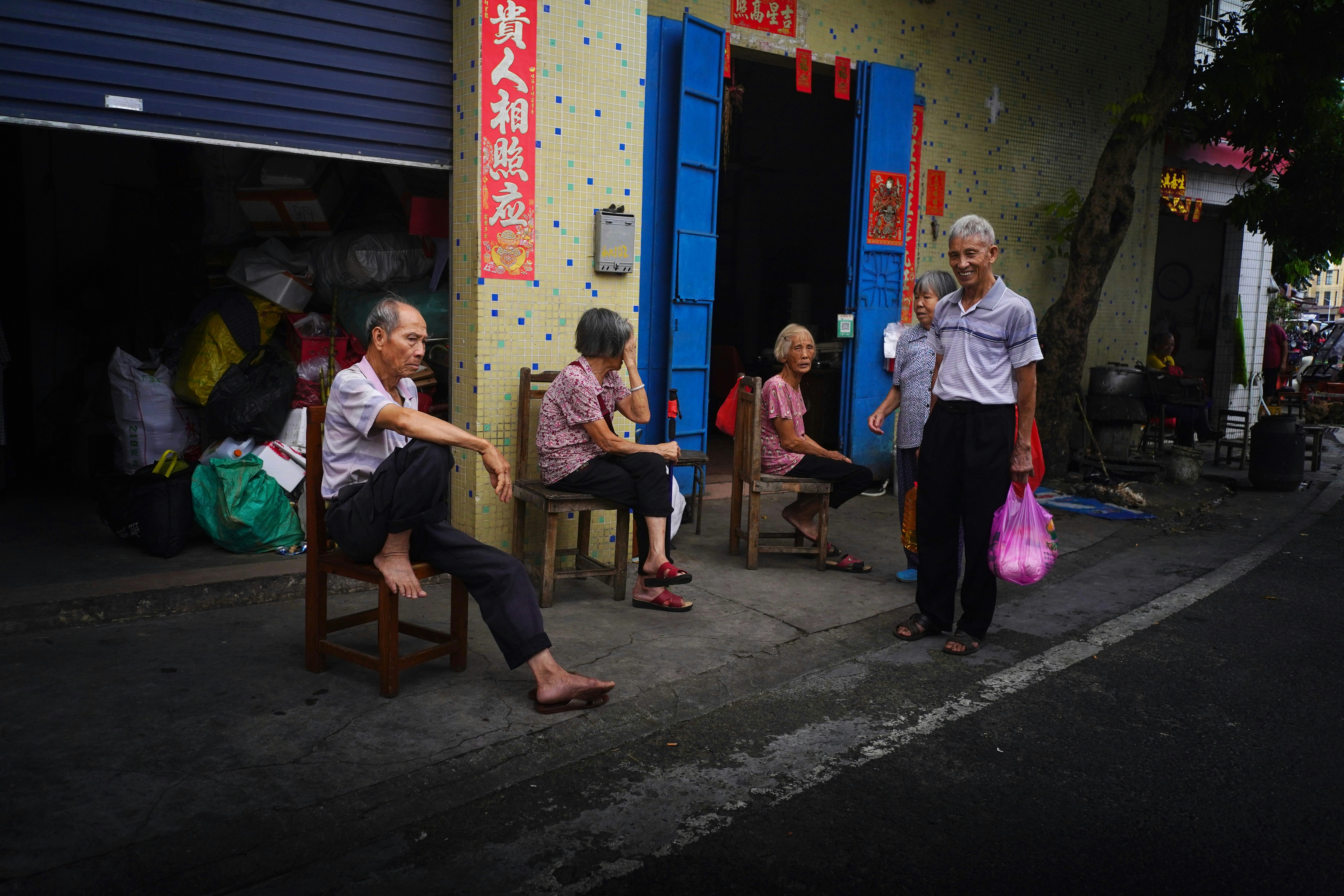 Evening Rest Outside a Street Vendor Row