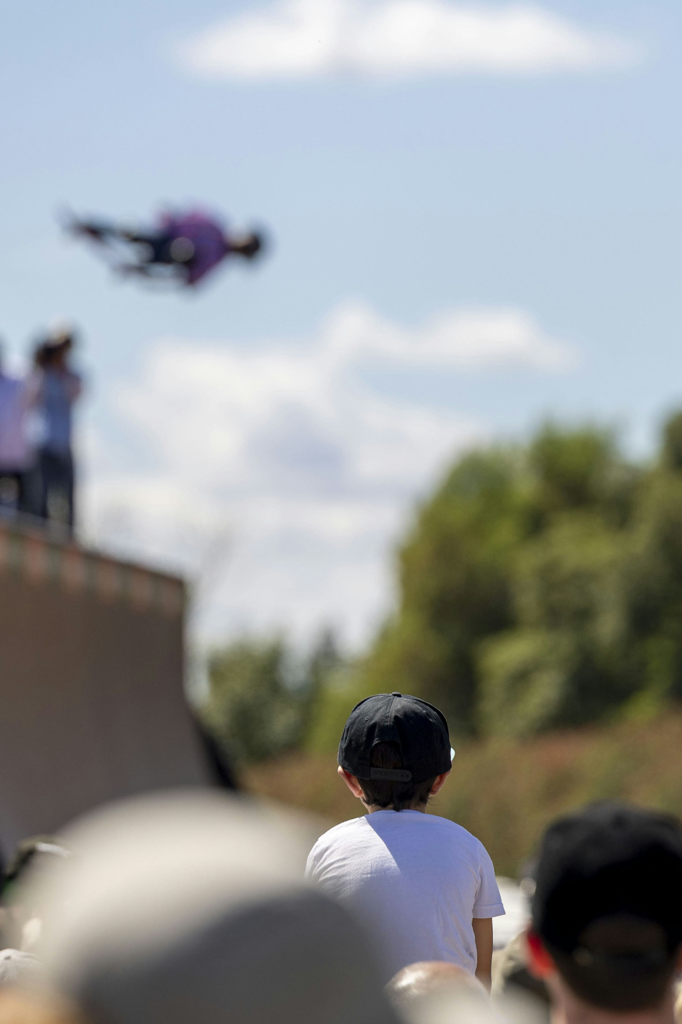 Blurred Flight: A Momentary Crowd and Rider in the Park Ramp