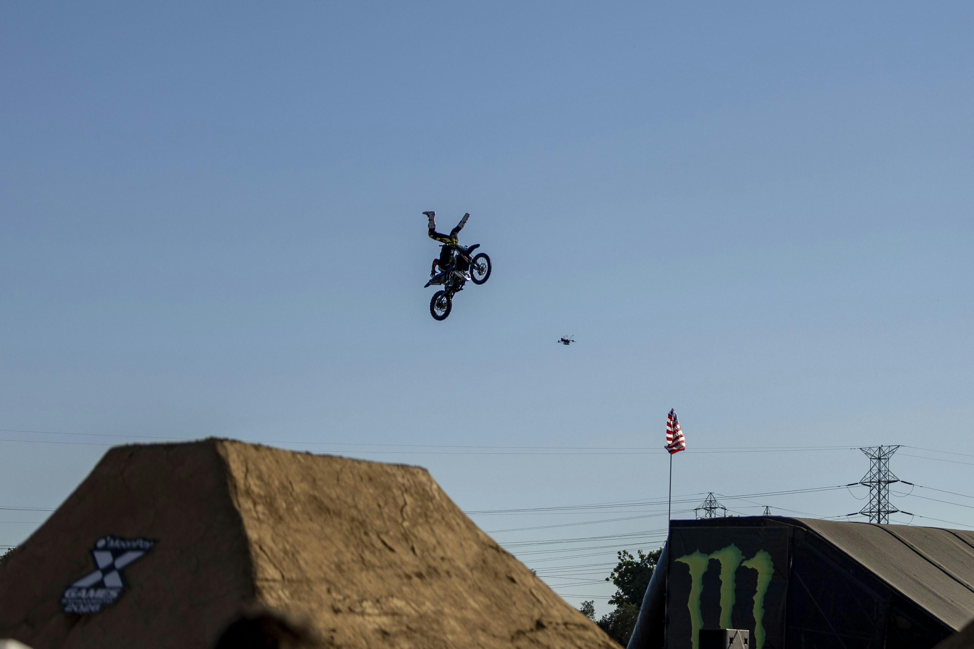 Midair Triumph: Rider Soars Off the Ramp Against a Clear Sky