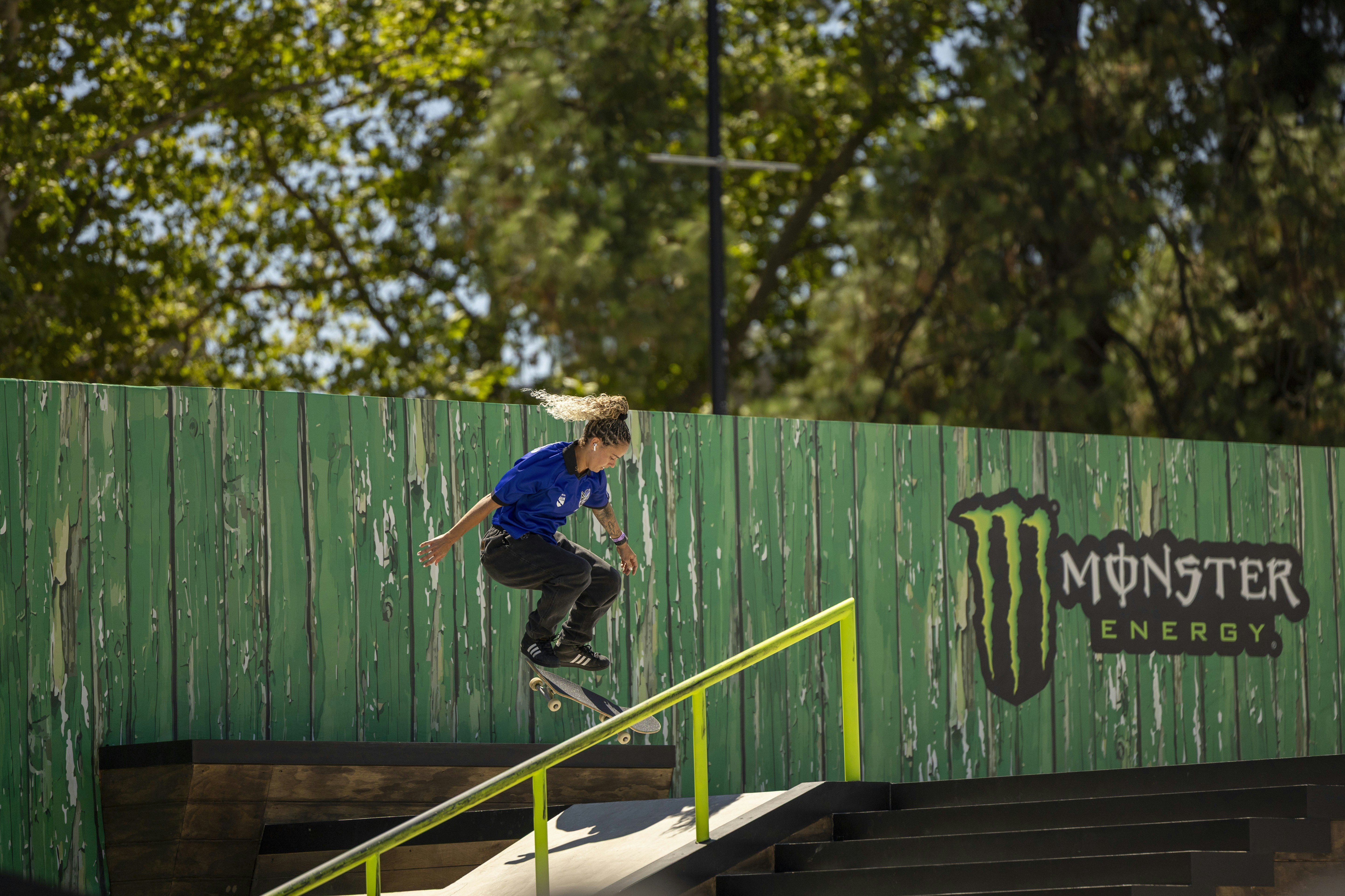 Airborne Grind: Skater Clears the Neon Rail