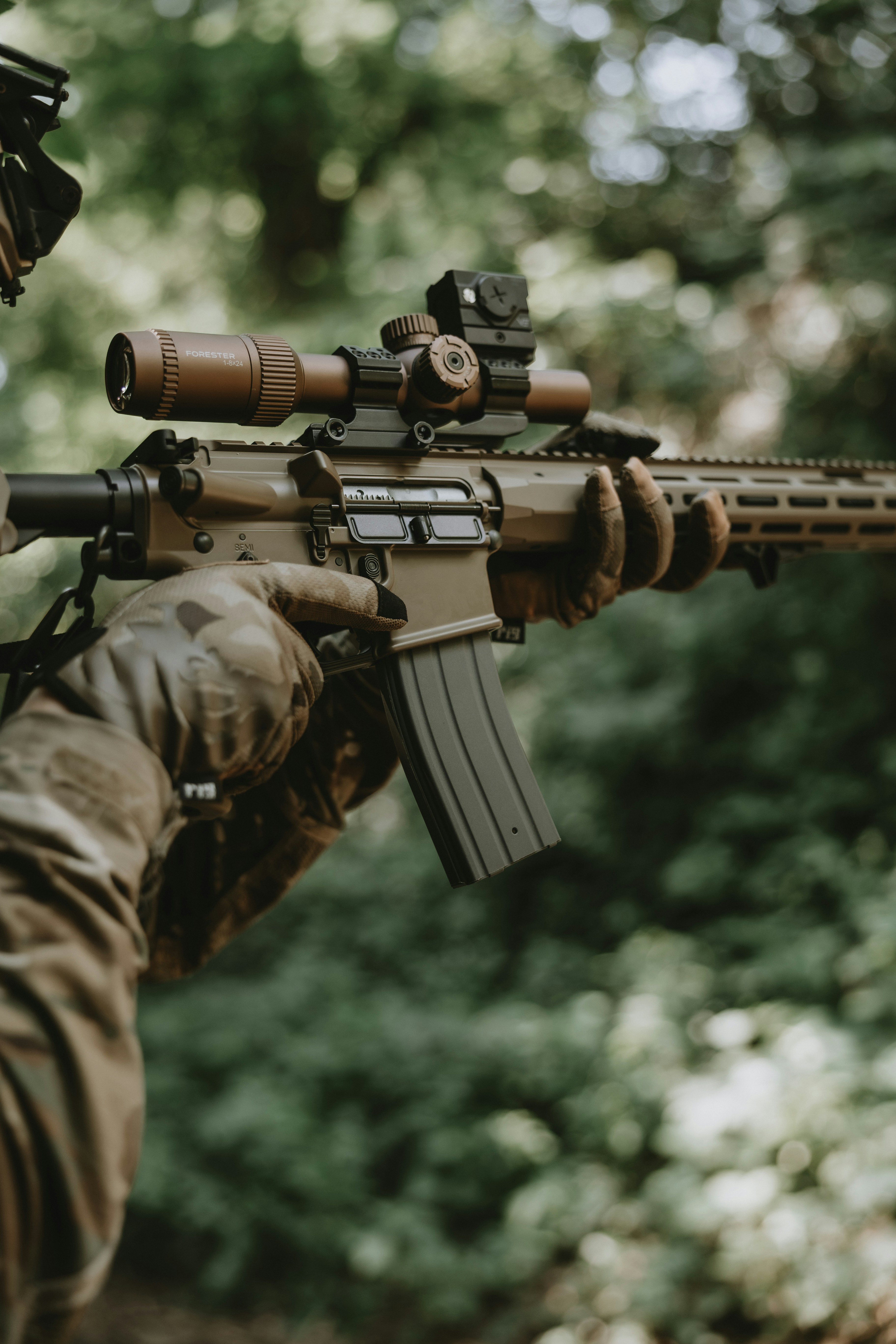 Precision in the Pines: Close-Up on the Rifle Scope and Handguard