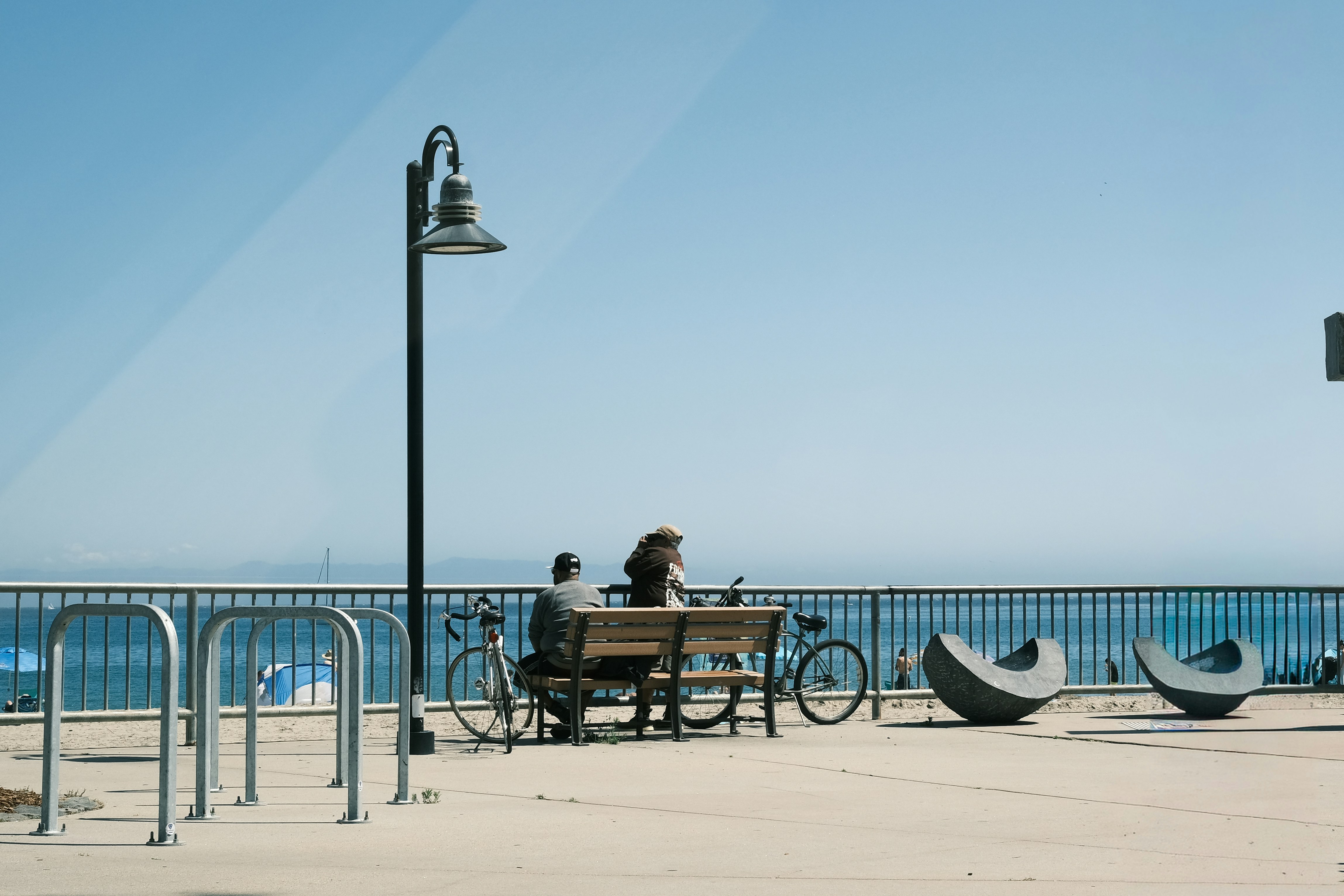 Seaside Bench: A Quiet Moment by the Biking Promenade