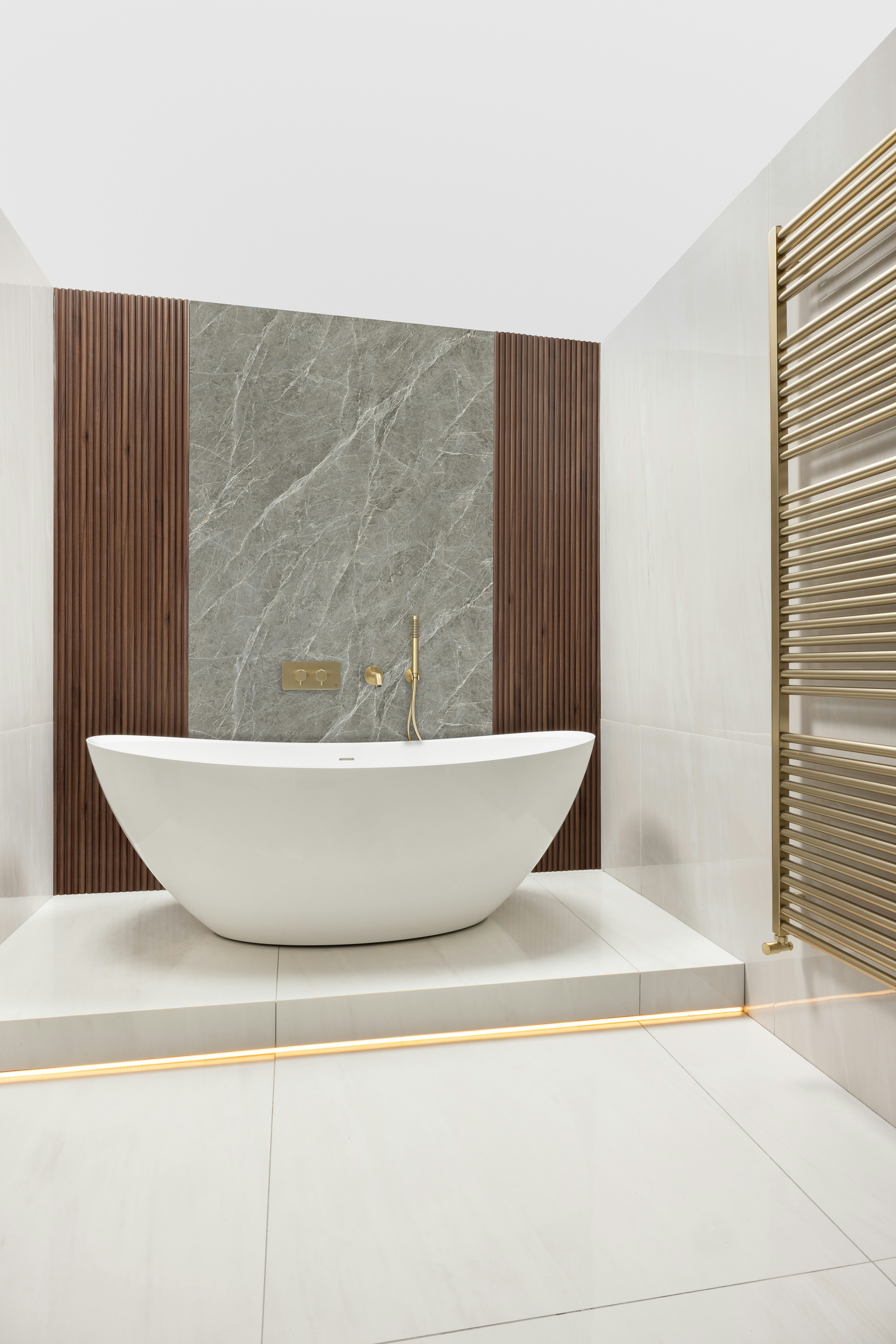 Spa-finished Soak: A Minimalist Marble Bath in Warm Brass and Wood