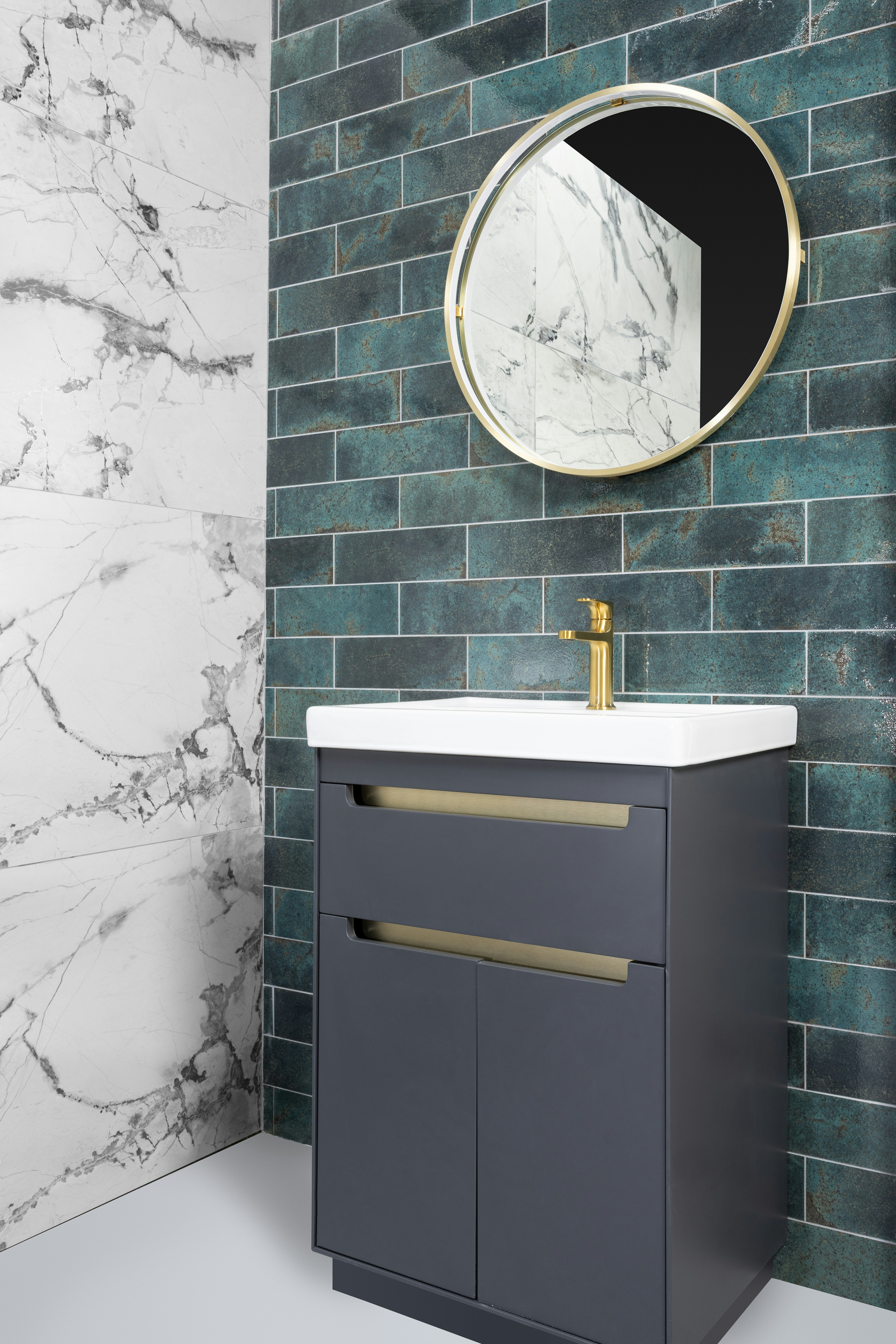 Glossy Slate Vanity with Brushed Gold Accents in Marble-Accent Bathroom
