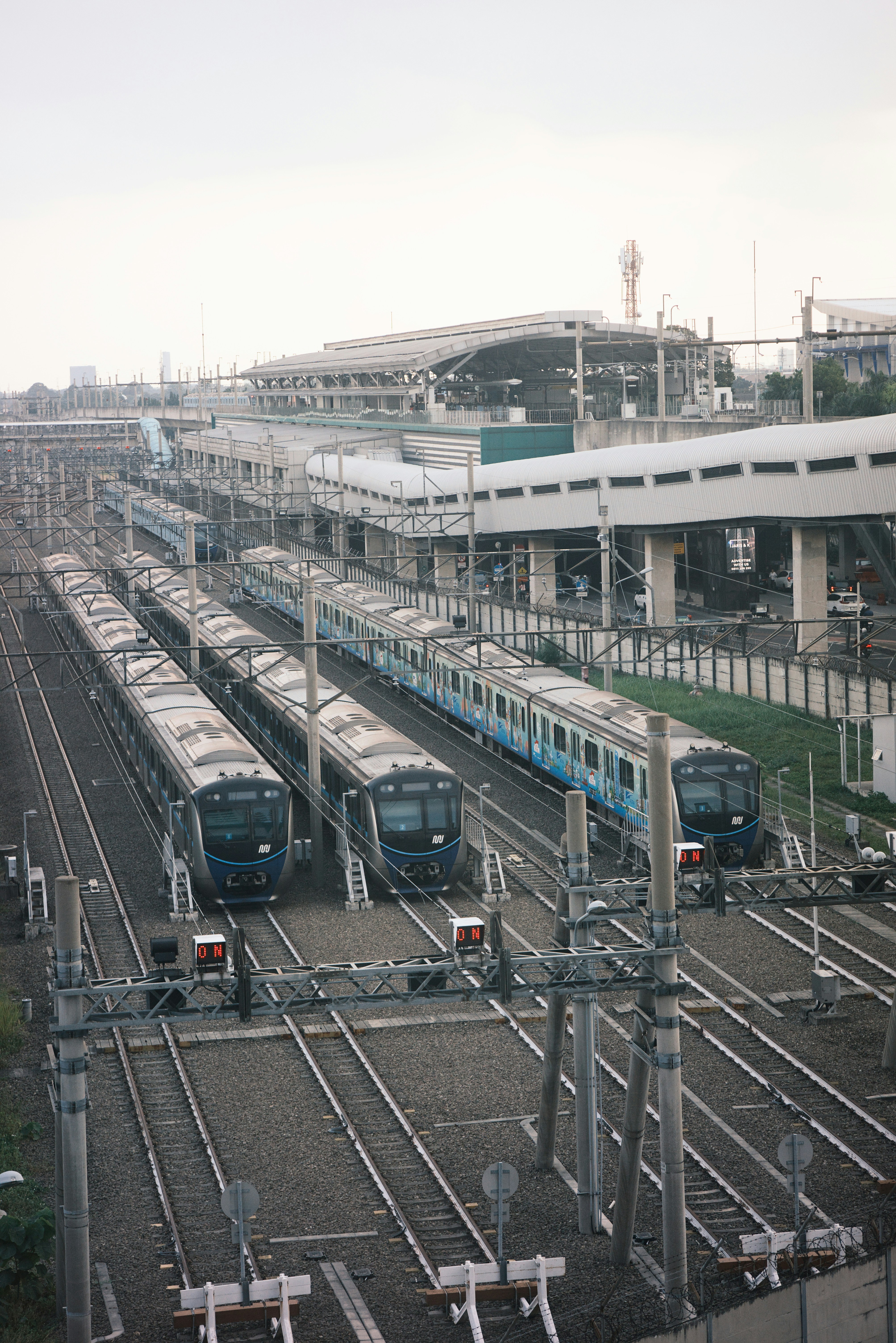 Aerial Lines: Commuter Trains Resting Along a Modern Station Arc