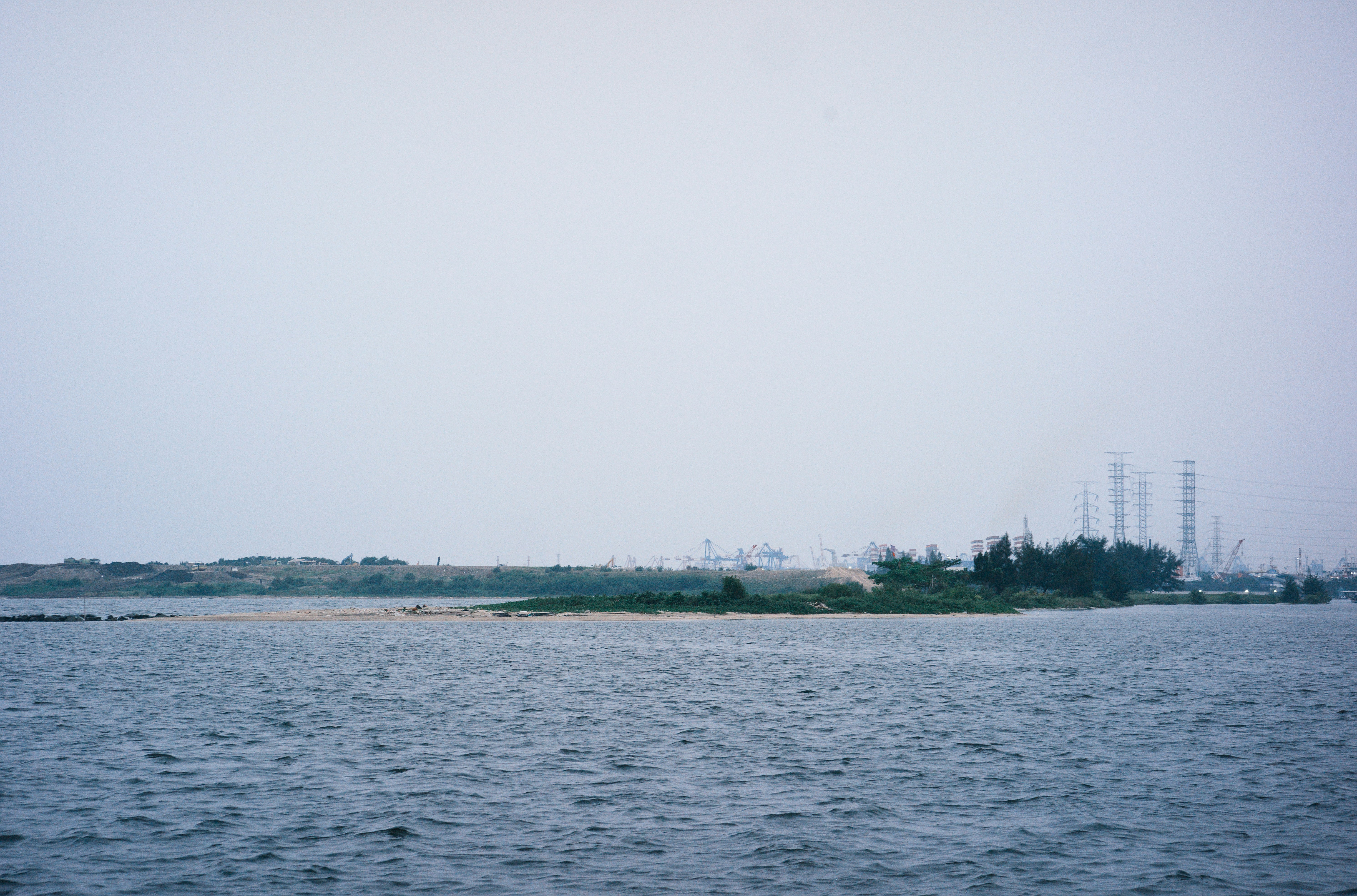 Coastal Horizon with Distant Infrastructure
