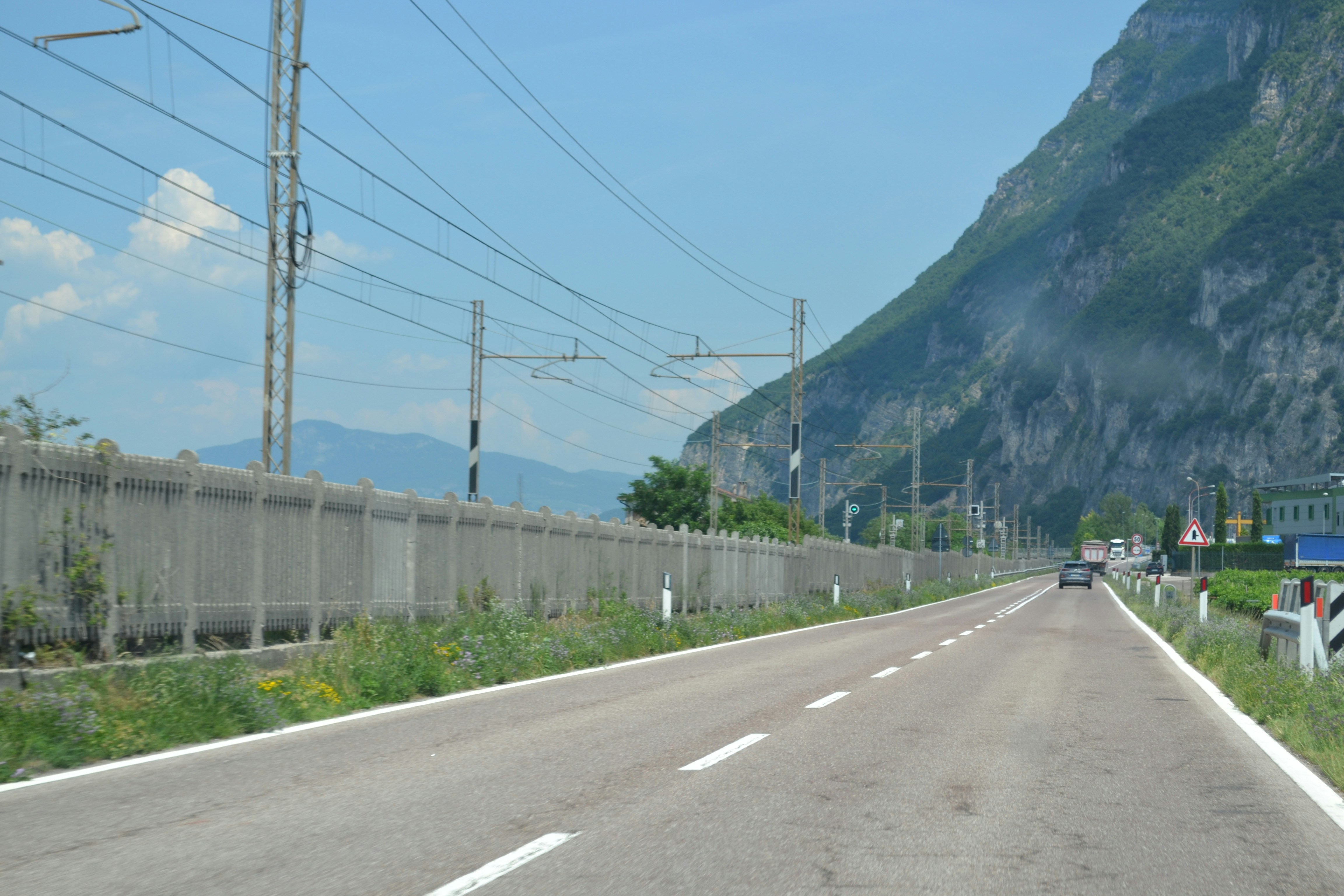 Rural Alpine Road Under Power Lines