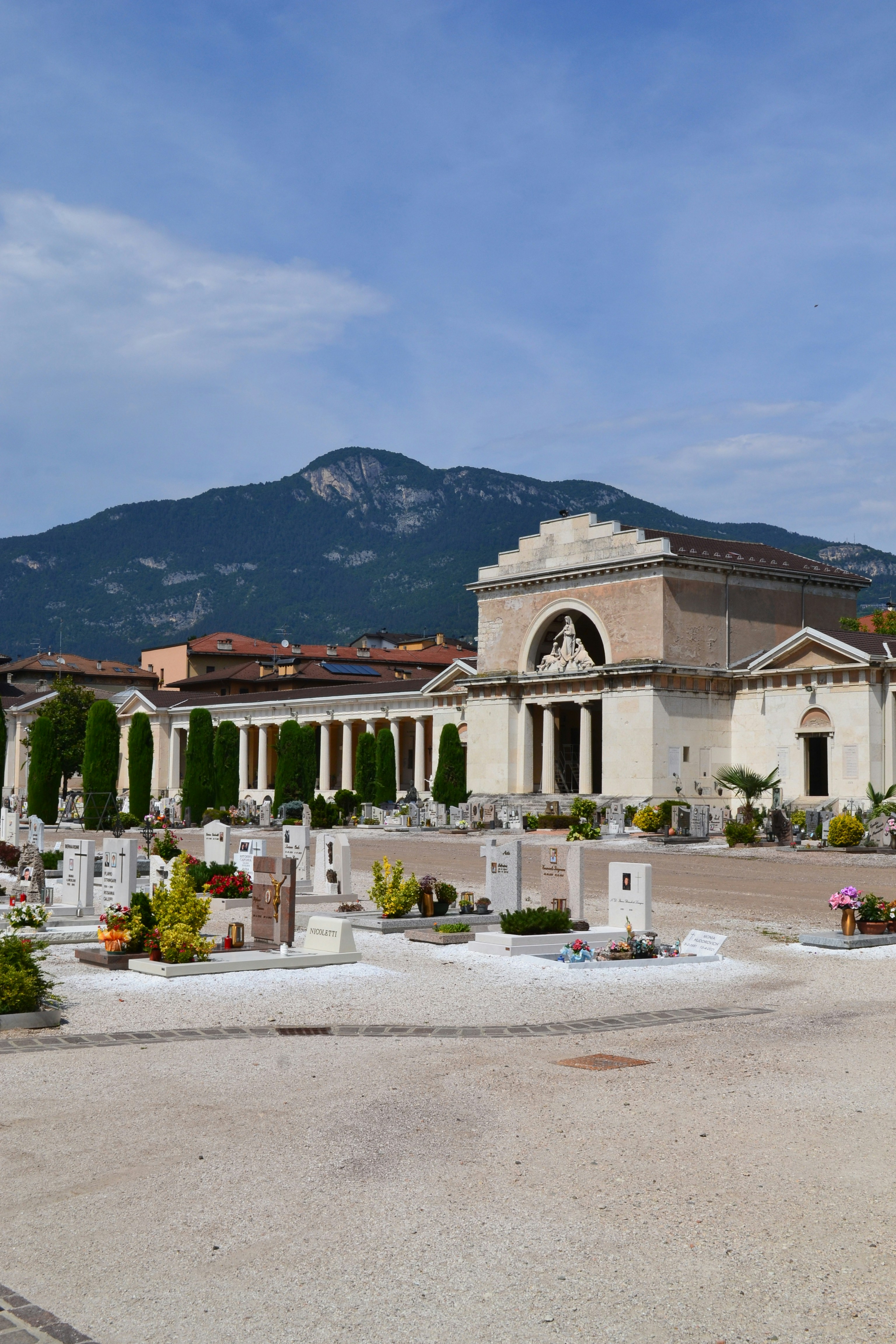 Monumental Baroque Facade Overlooking a Restful Cemetery Courtyard