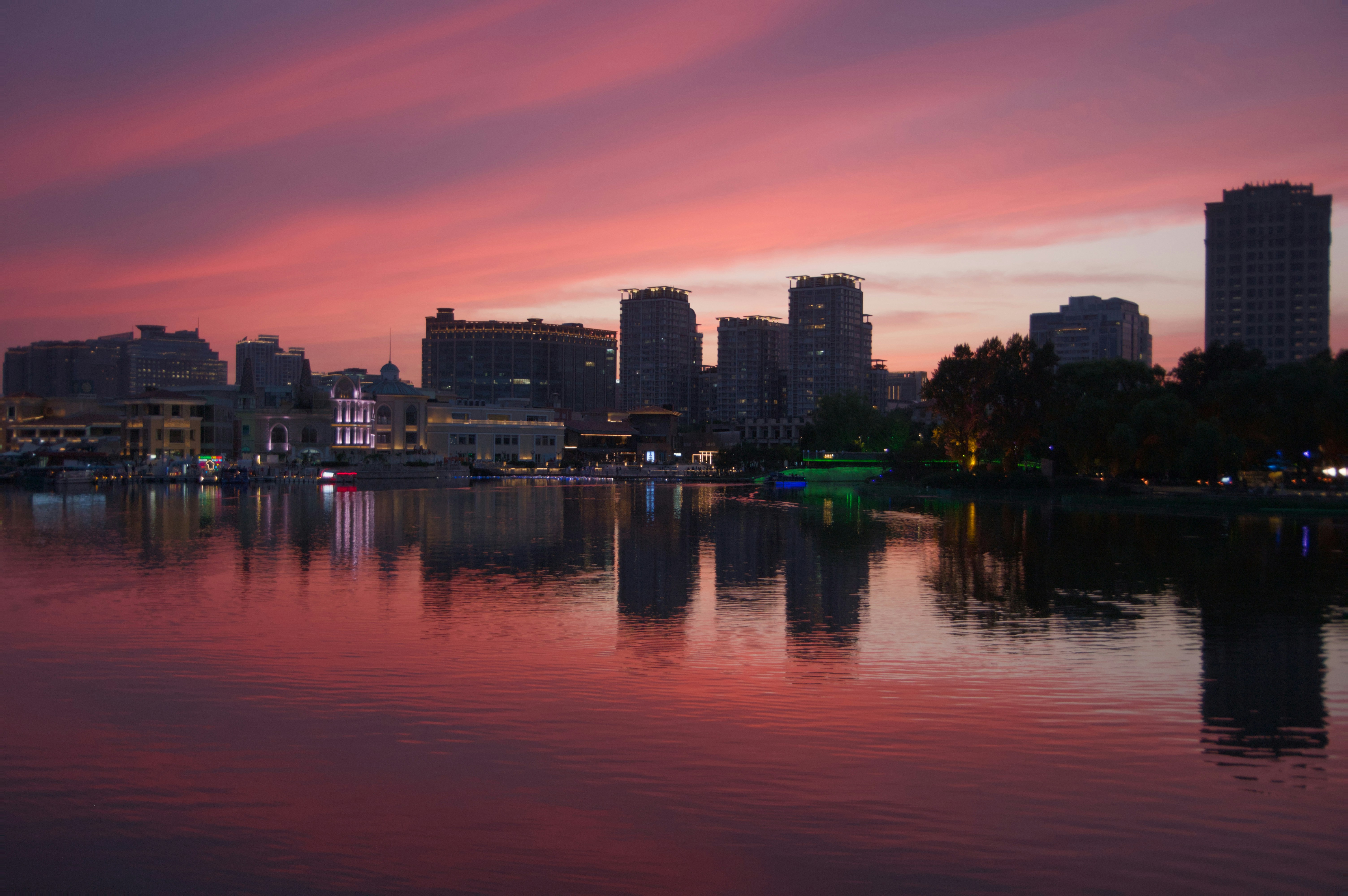 Sunset Skyline Over Quiet Waterfront