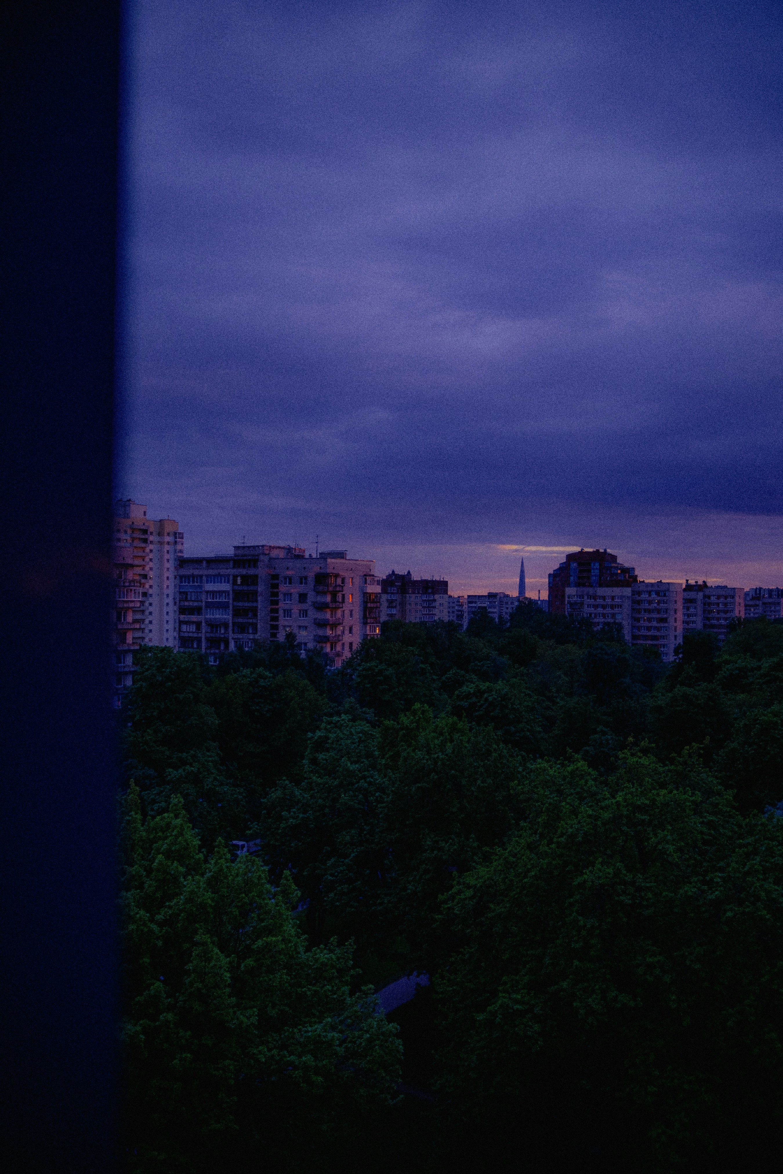 Dusk Over the City silhouette from a Rooftop Edge