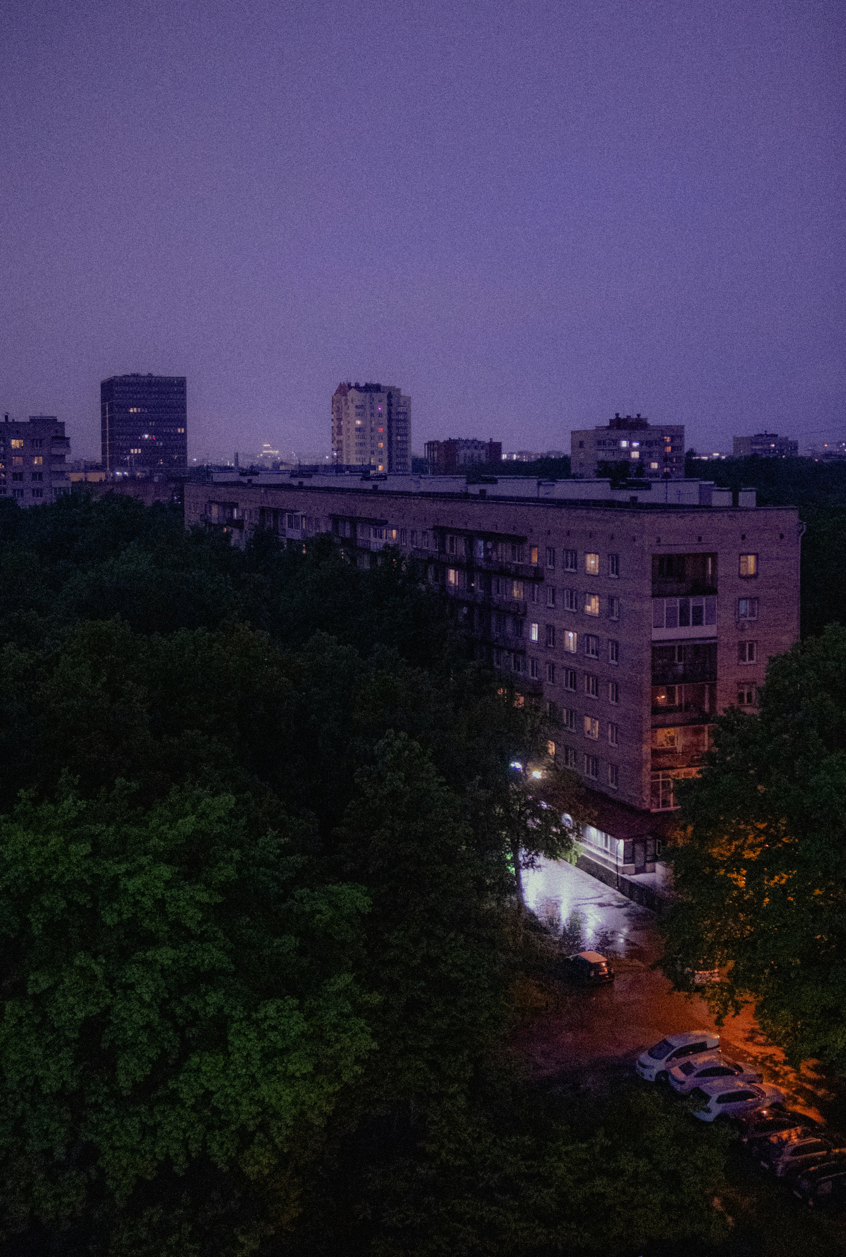 Evening Overlook: City Block lit by Street Lamps