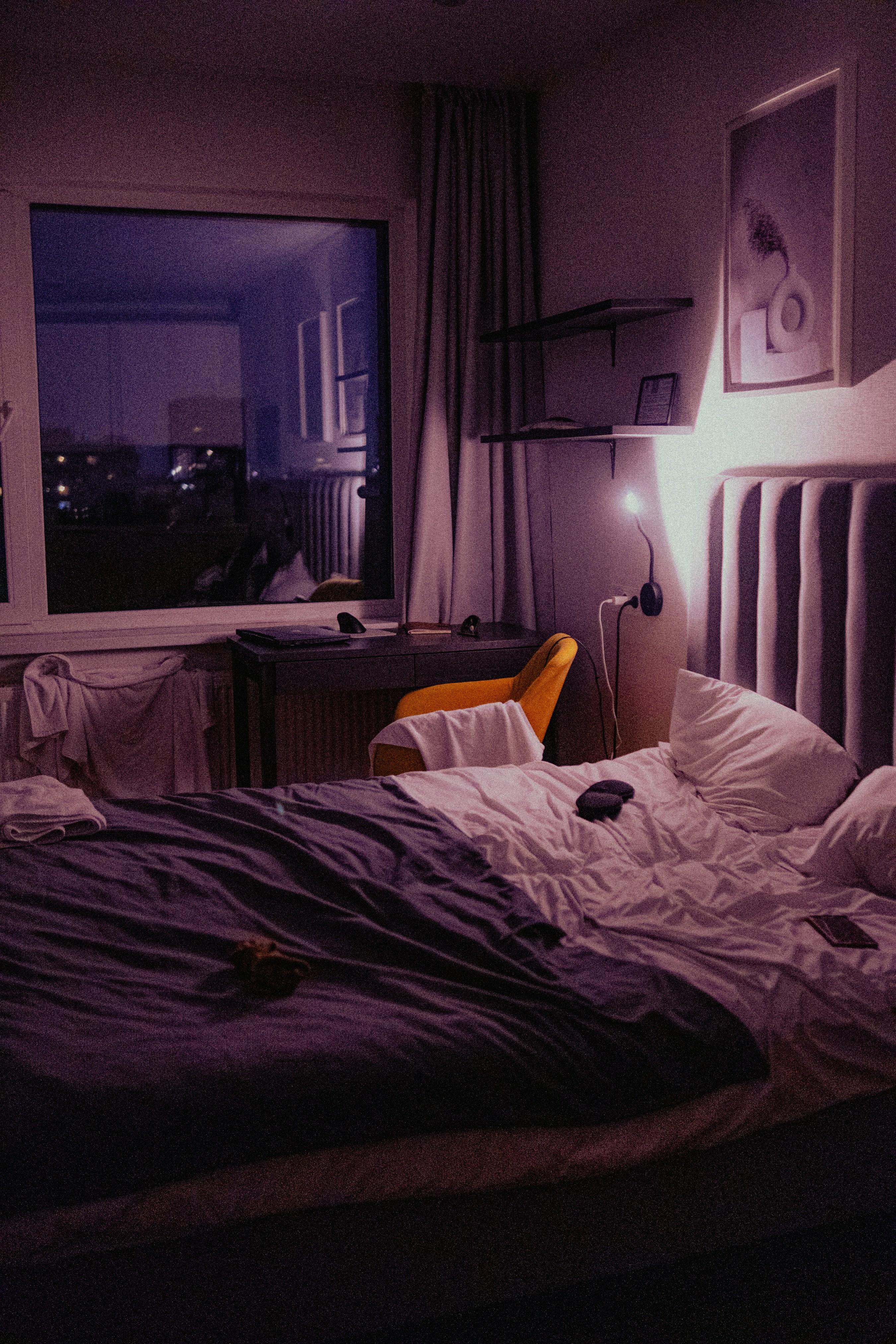 Dim Hotel Room at Dusk: A Quiet Night in Violet Hue