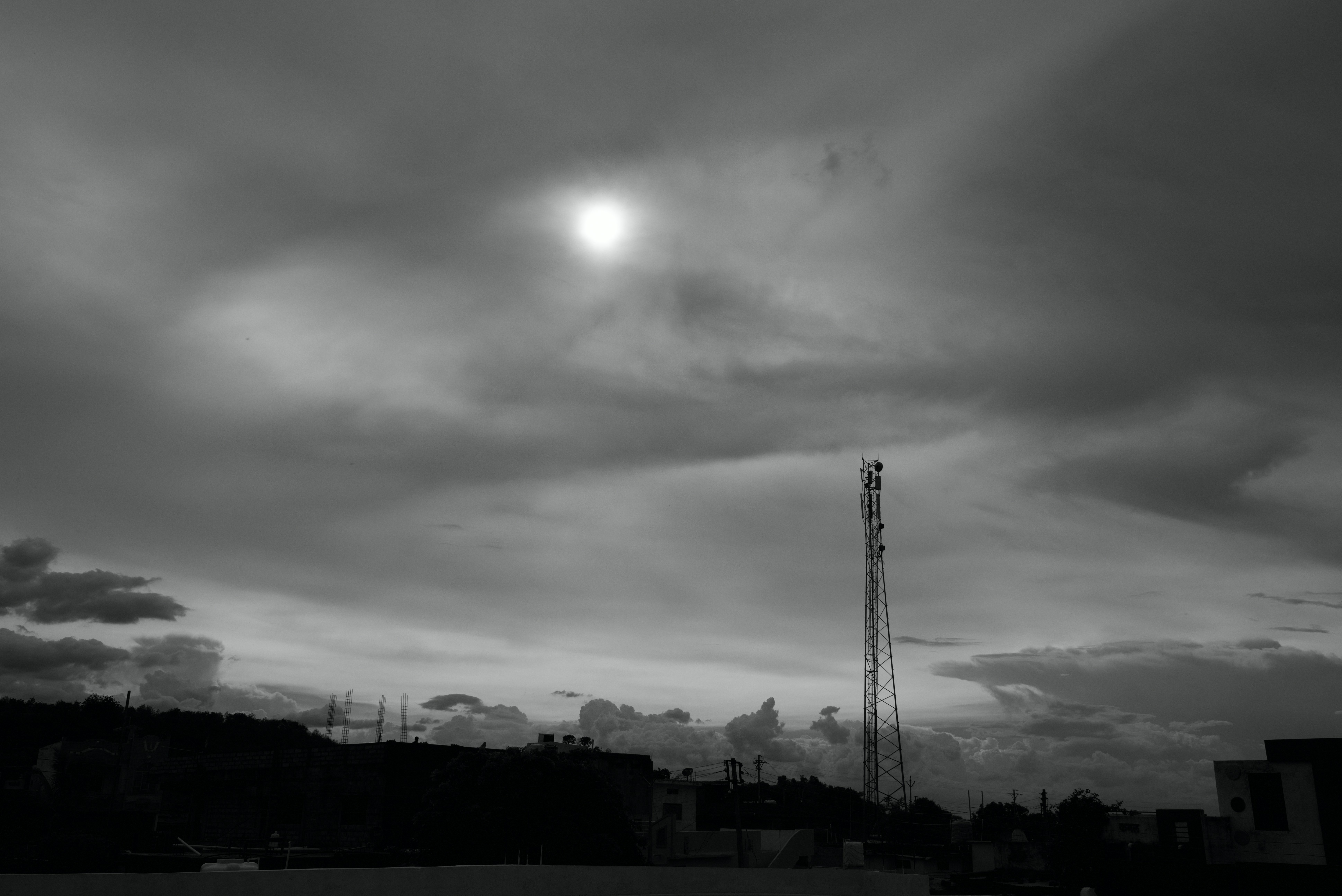 Overcast Skyline and Transmission Tower in Dim Twilight