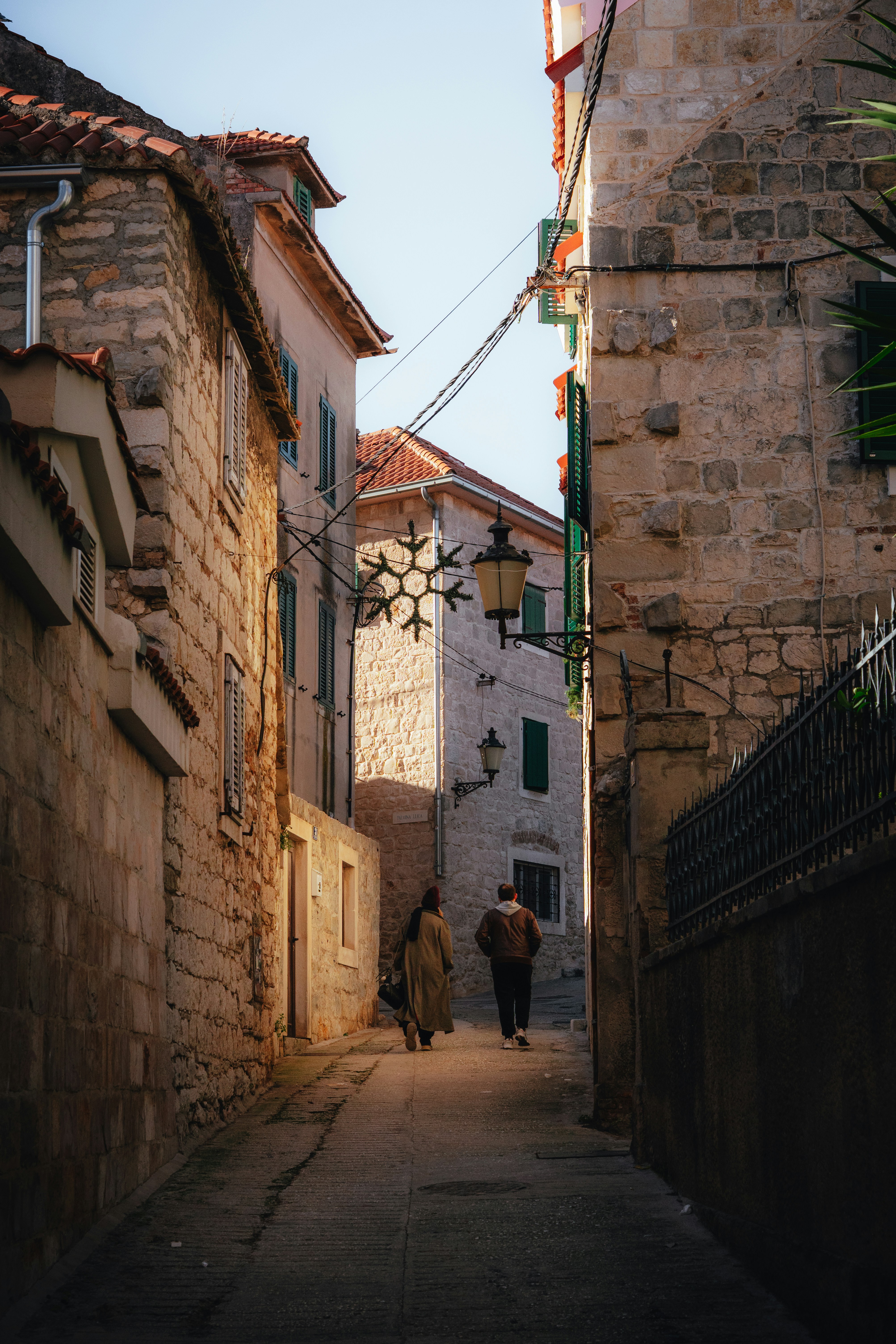 Sunlit Alleyway Toward A Quiet Junction