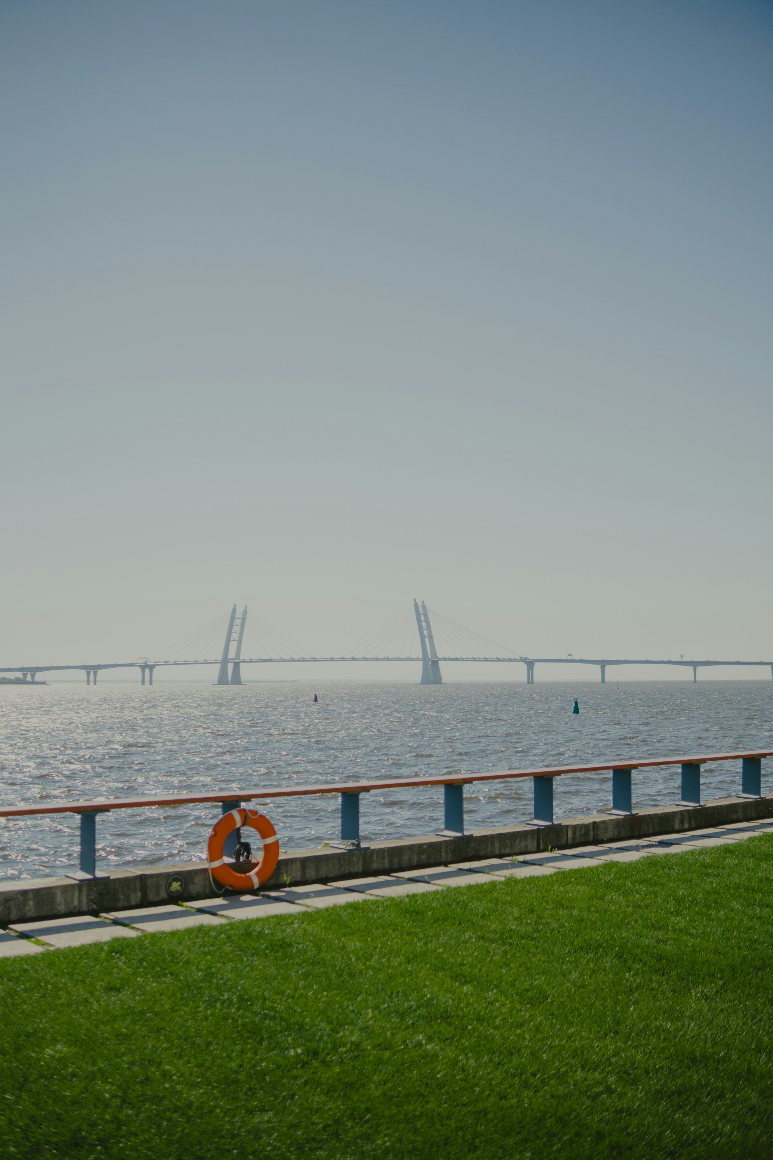 Lakeside Pier with Modern Bridge Silhouettes