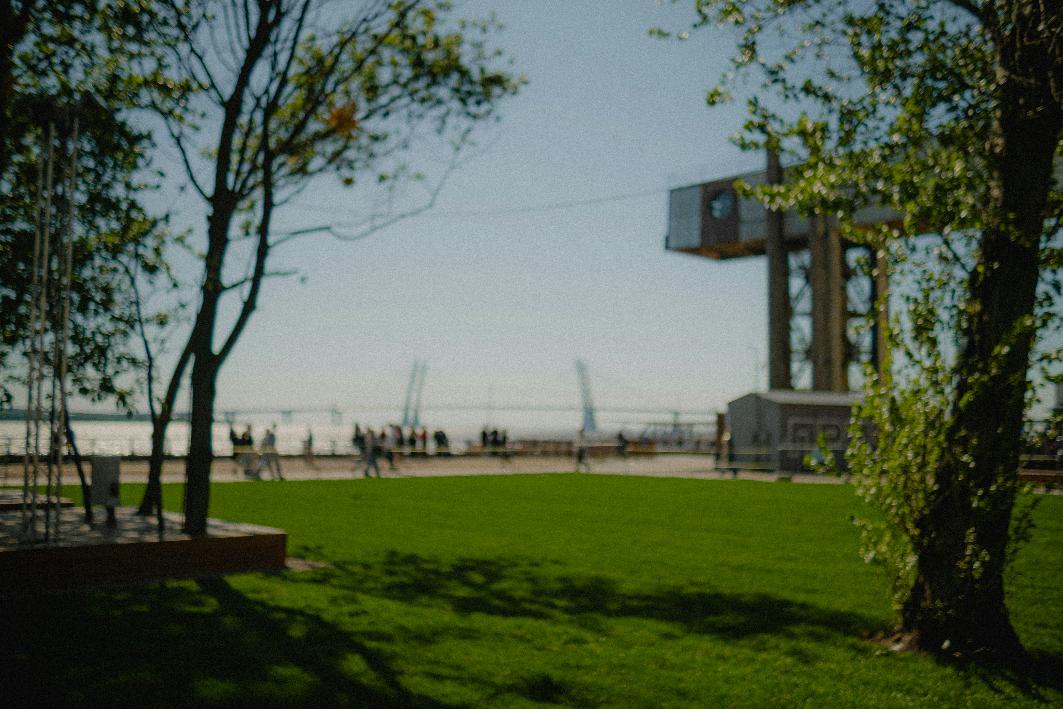 Breezy Seaside Promenade with Distant Silhouettes