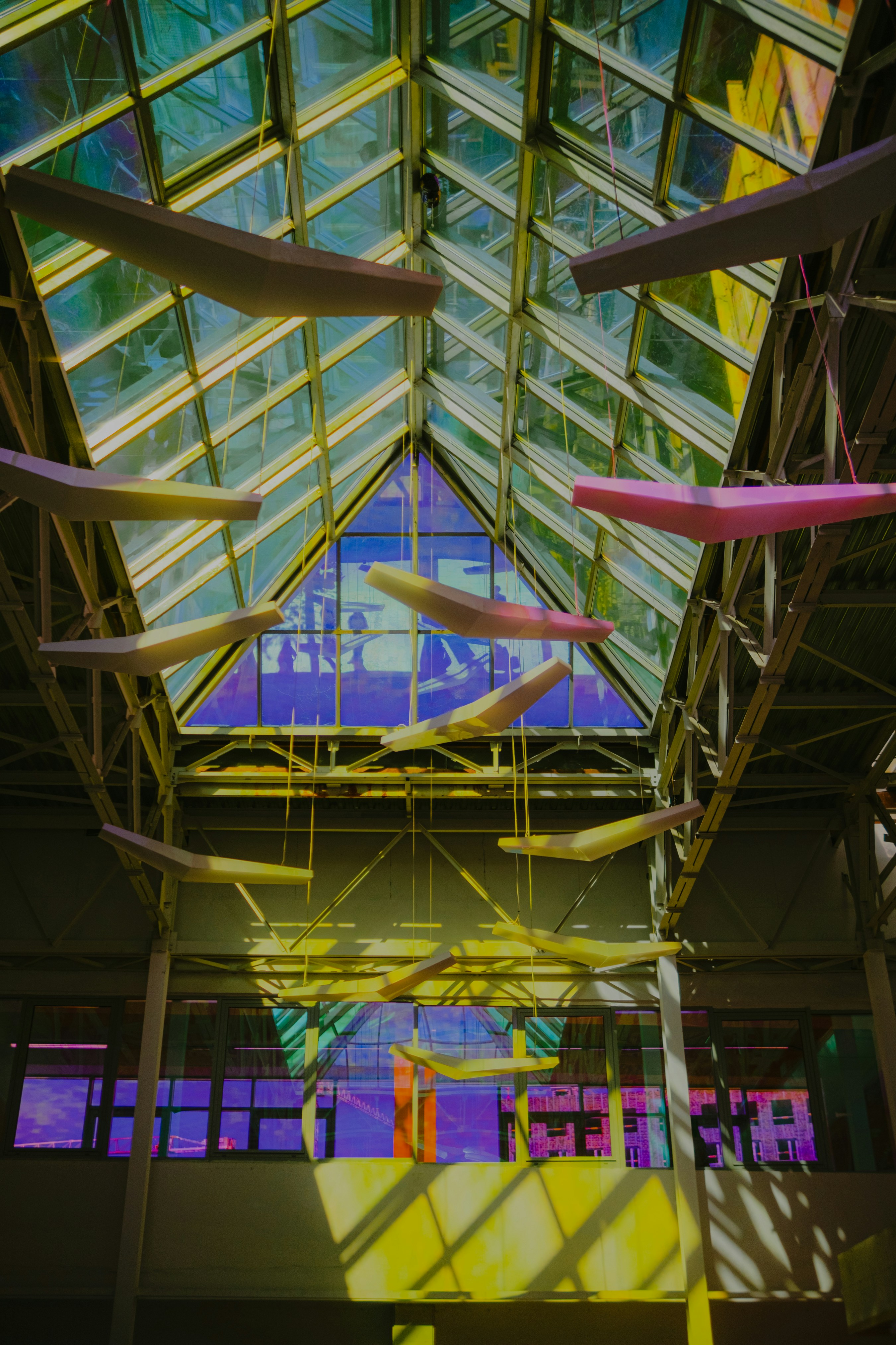 Colorful Atrium Canopy: Light and Shadows Through a Glass Roof