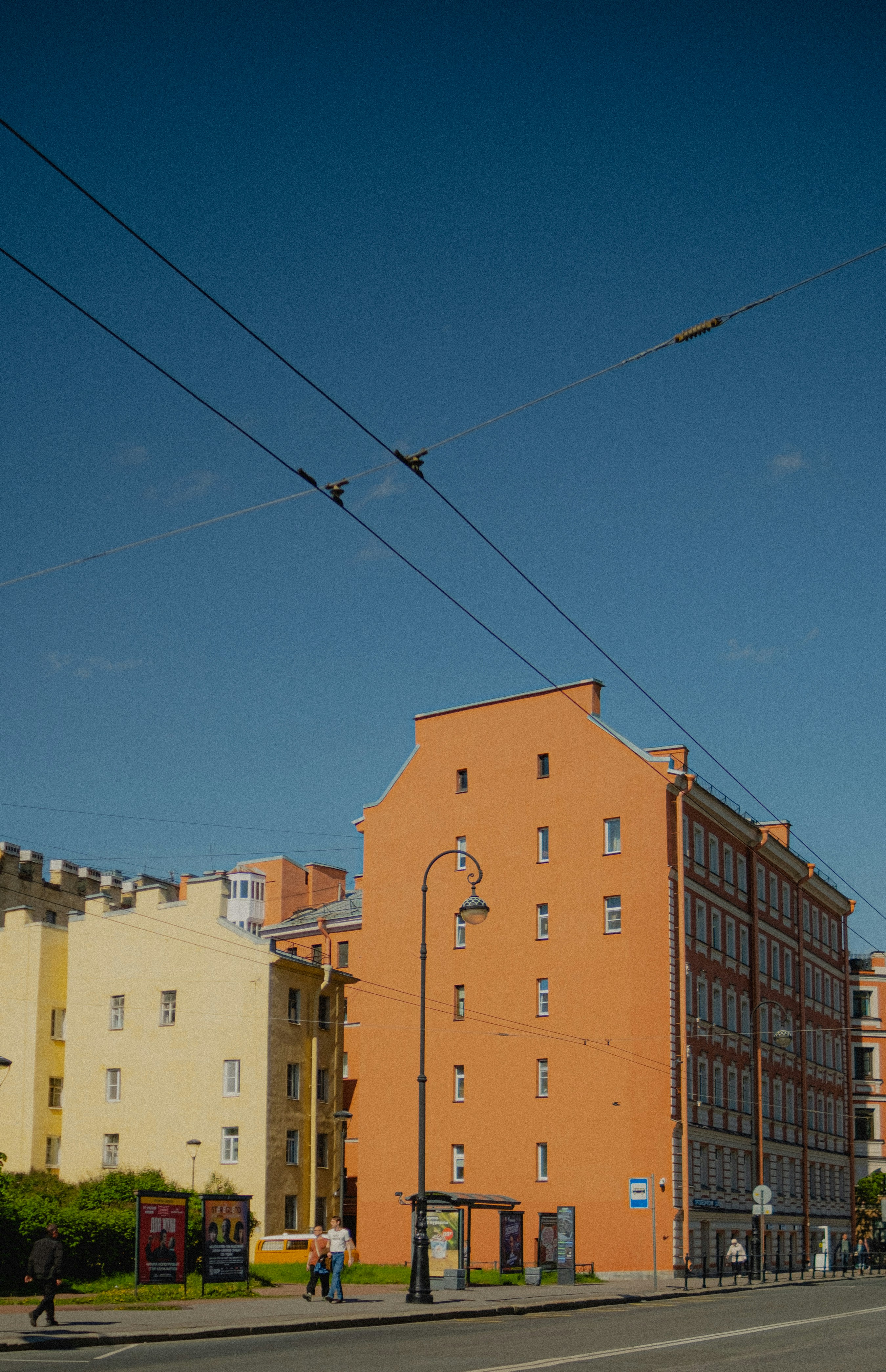 Orange Corner: A Sunlit Facade Anchors a Quiet City Street