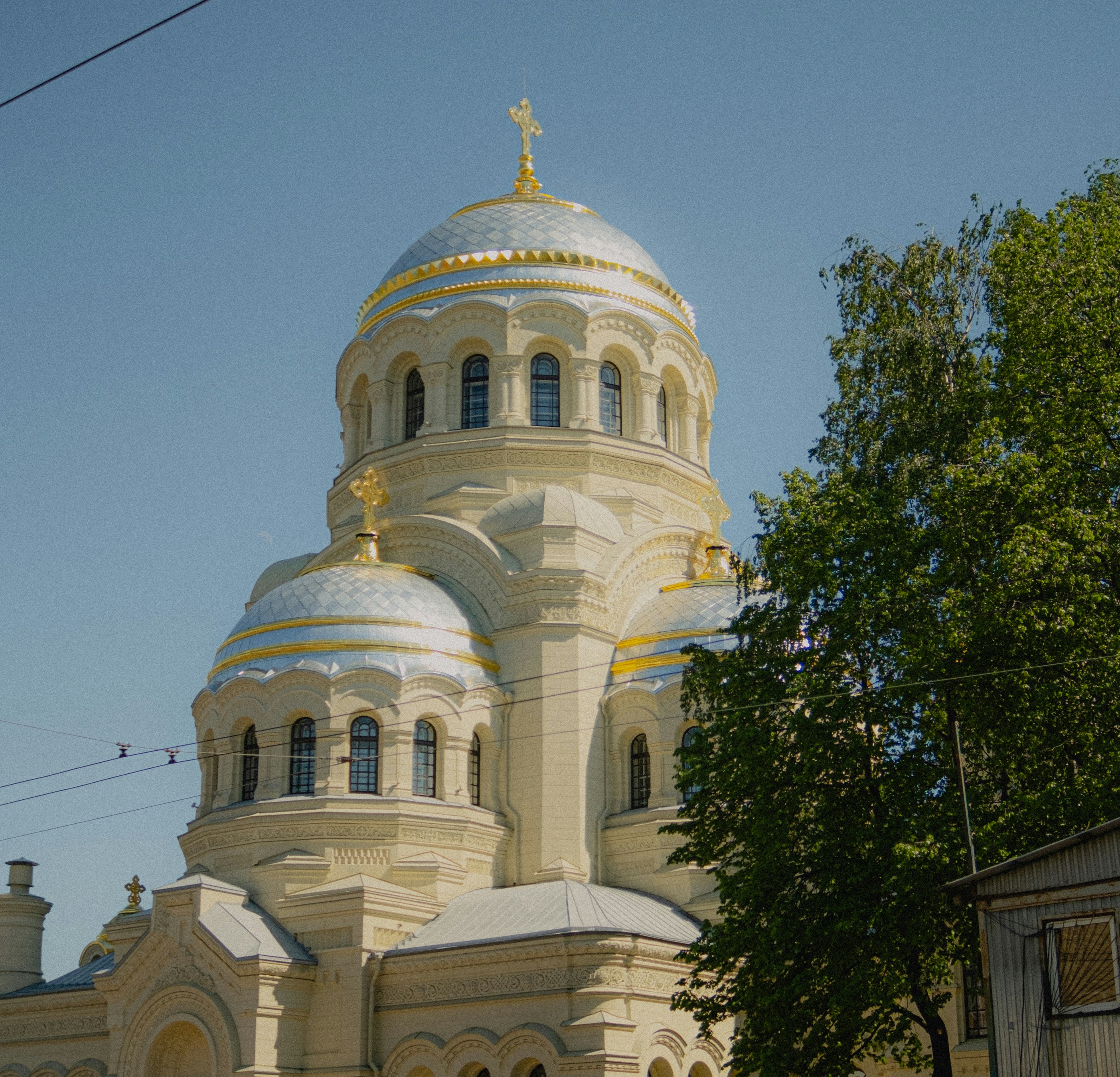 Sunny Orthodox Dome: A Creamy Cathedral Rising Against a Blue Sky