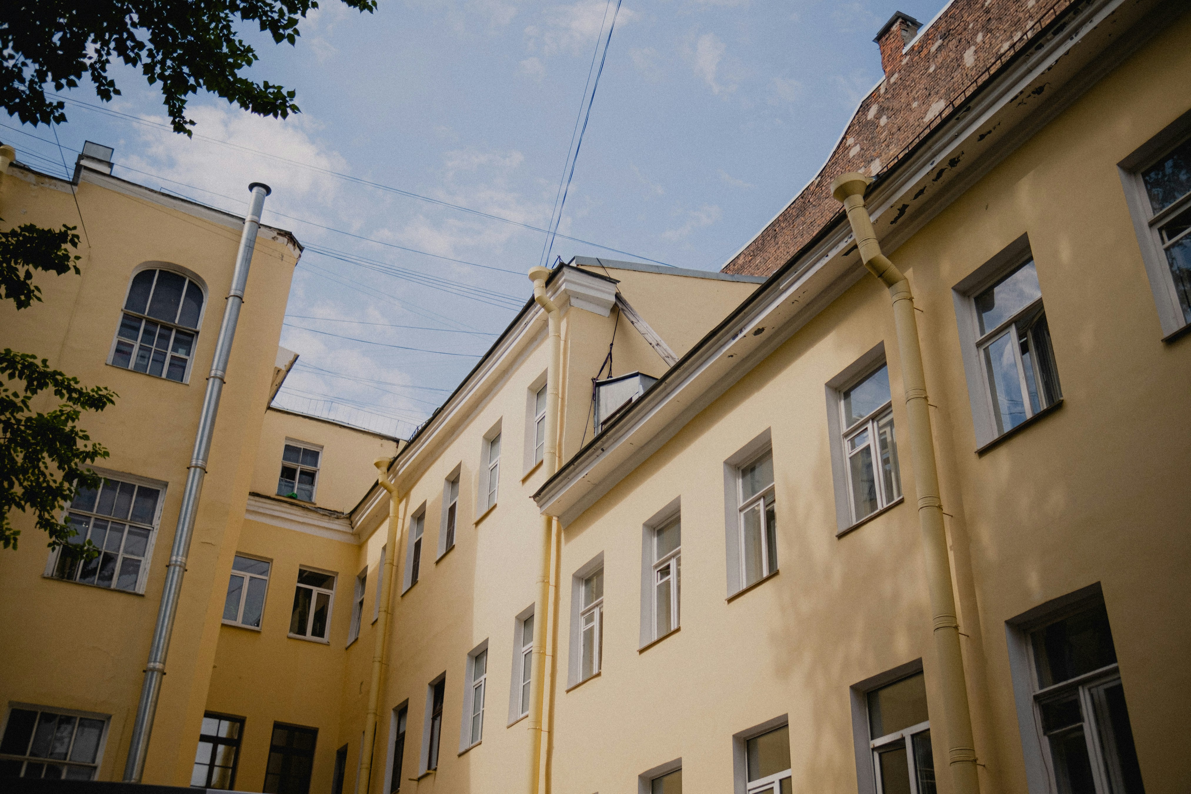 Sunlit Yellow Courtyard: An Architectural Sketch in Light and Shadow