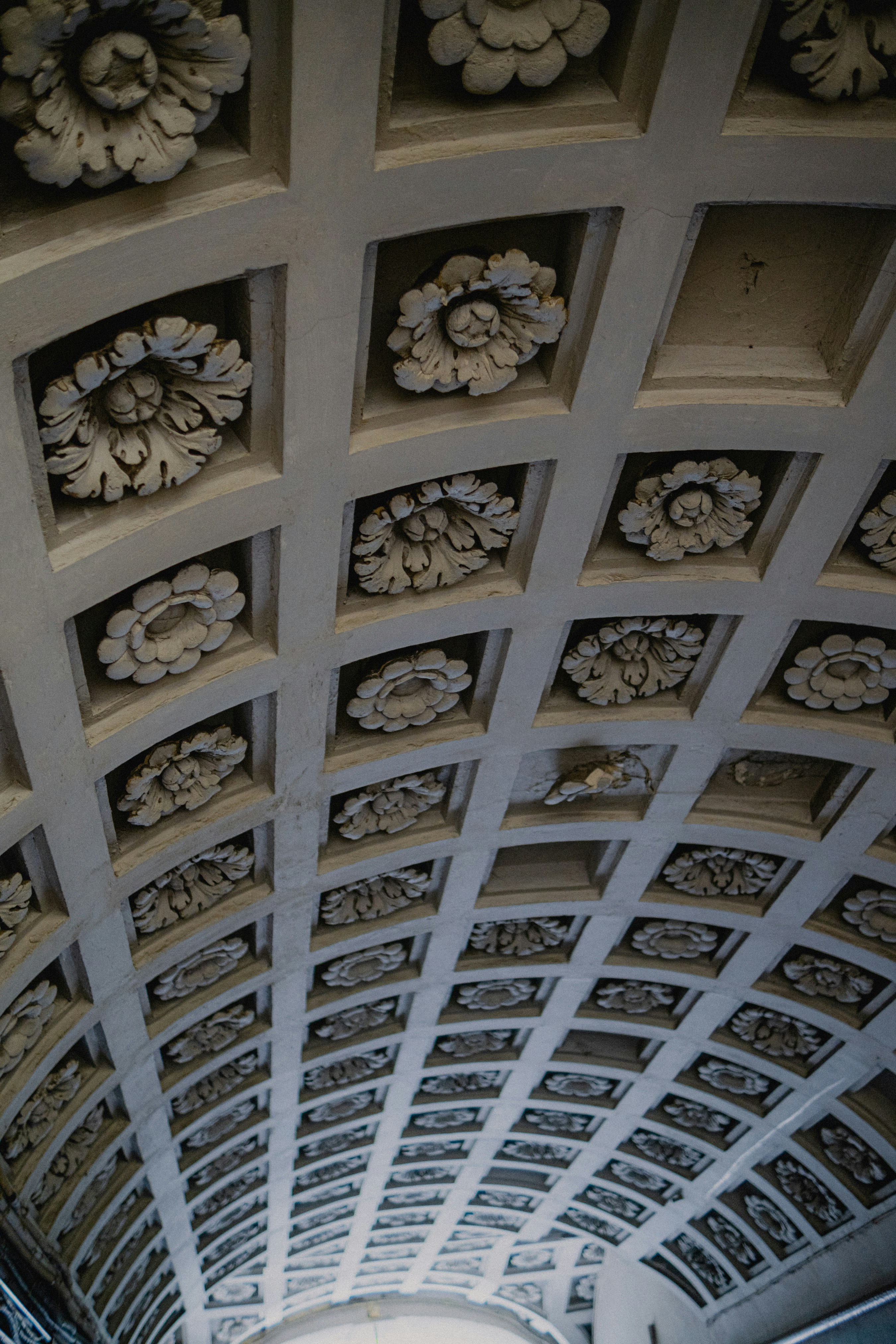 Symmetrical Coffered Vault: Receding Floral Tiles in Archway