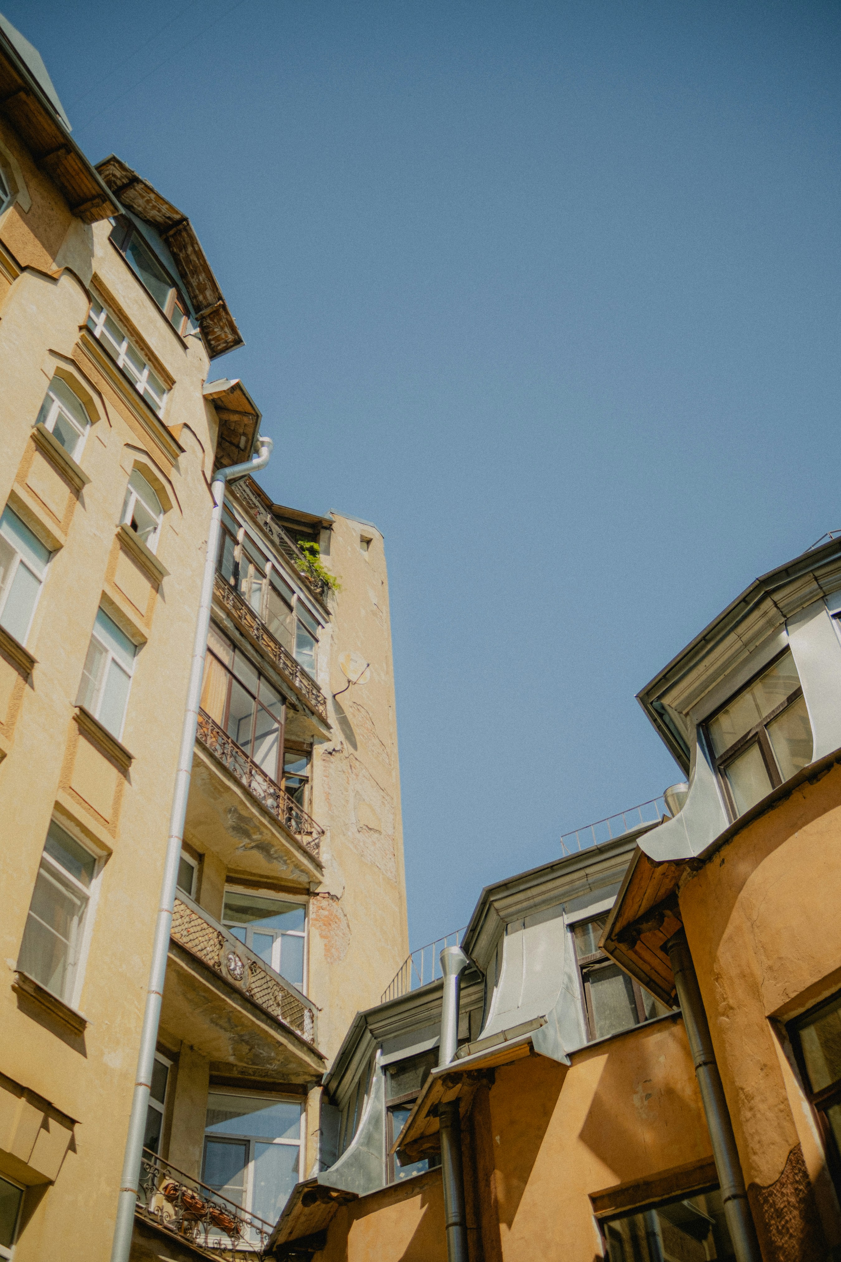 Sunlit Angles: A Cornered Cityscape Reaching for the Sky