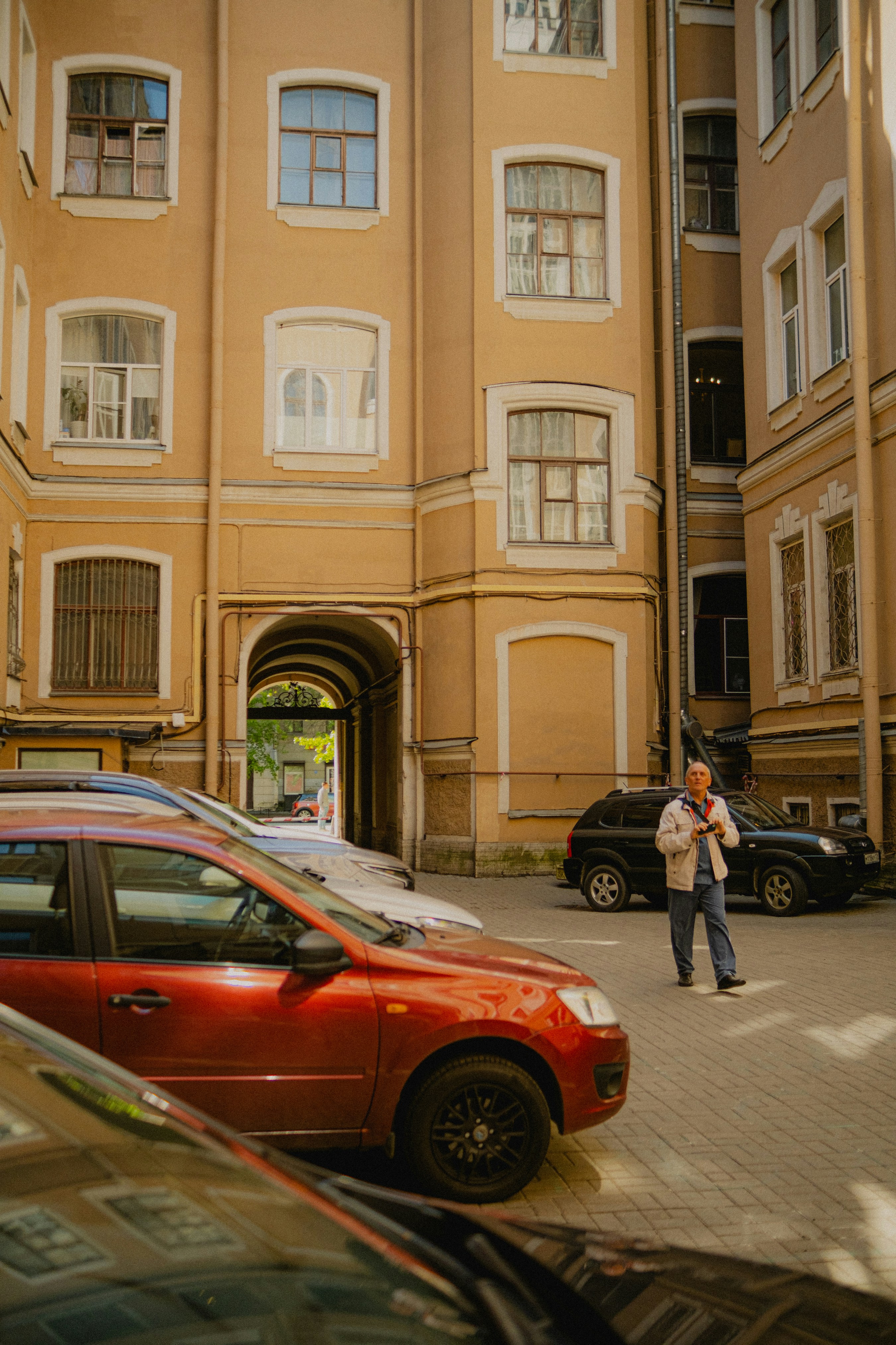 Passerby at the Arcaded Courtyard