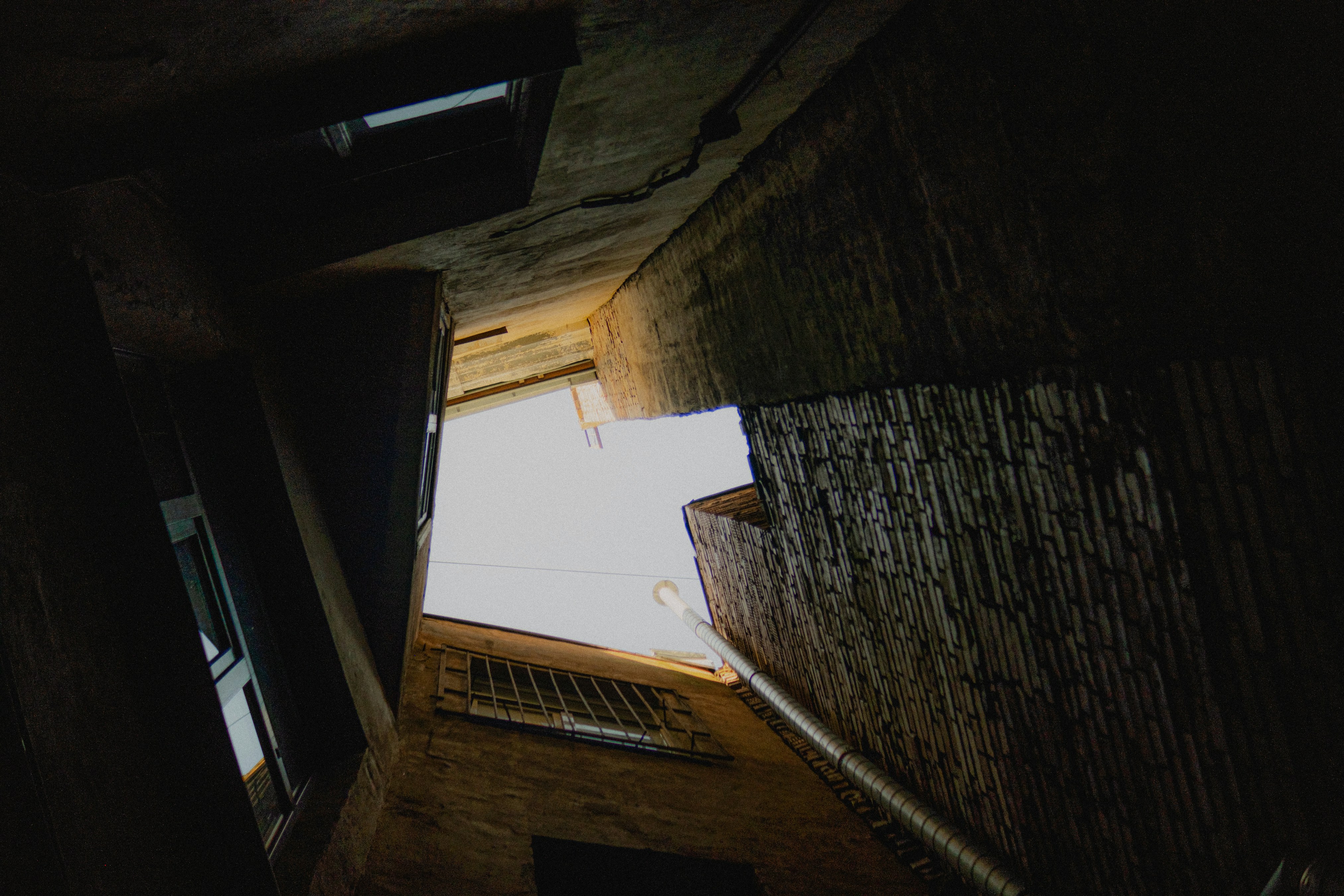 Canyon of Brick and Light: A Narrow Skyward Alley