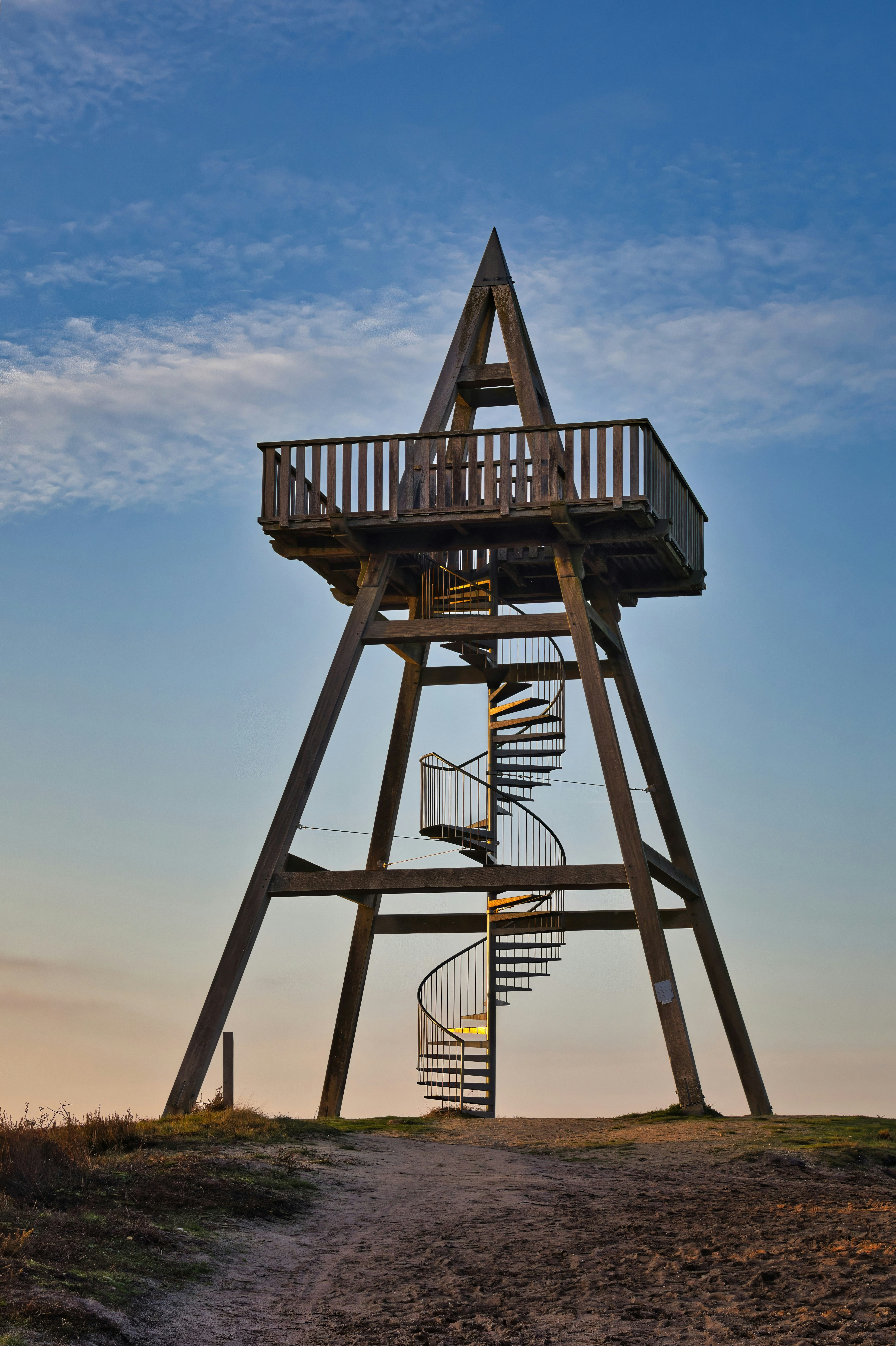 Elevated Lookout: A Vertical Spiral Against the Evening Sky
