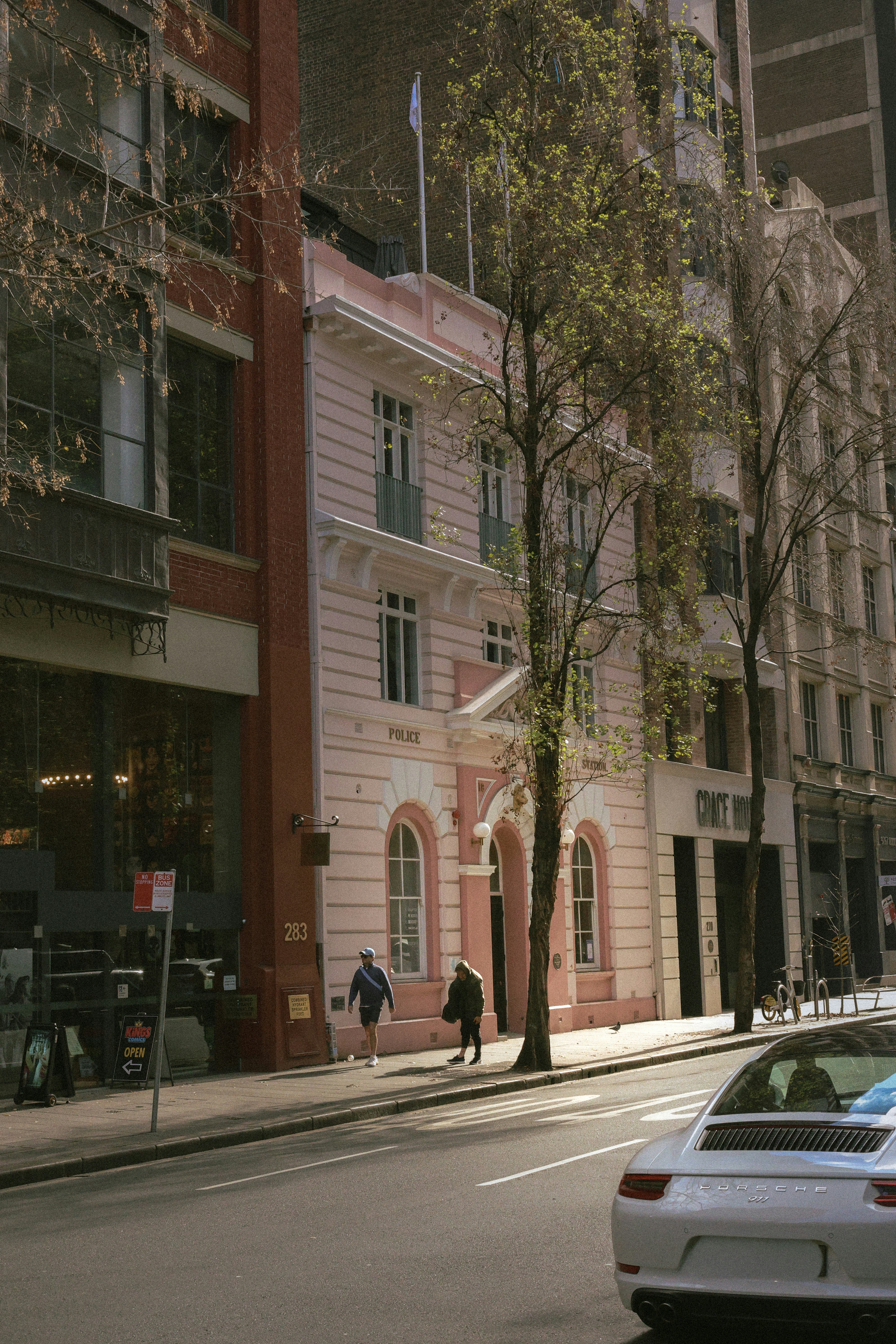 Pastel Facade Mission: A Quiet Street Between Giants