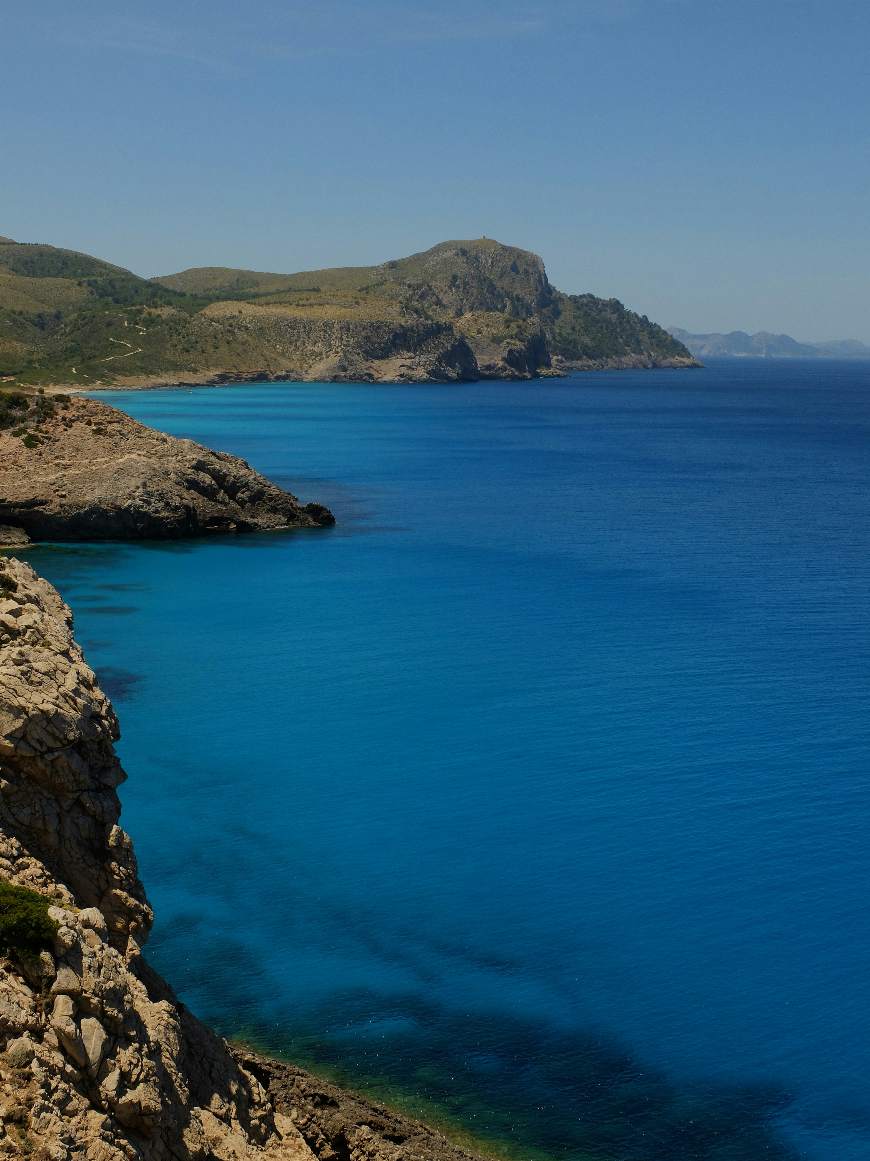 Azure Cliffs and Sea: A Coastal Vista in Rich Hues