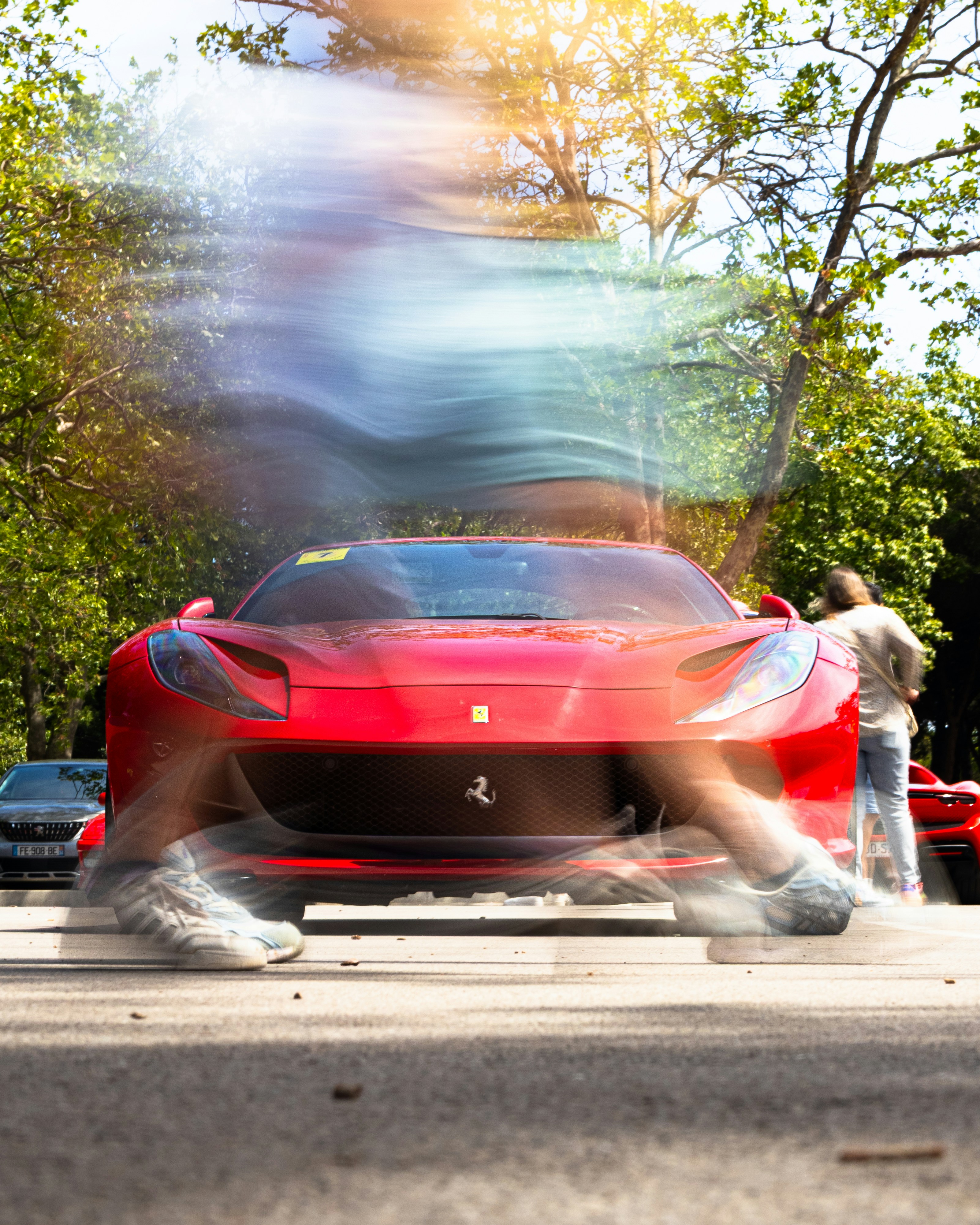 Blurred Motion, Red Ferrari: A Street-Edge Moment