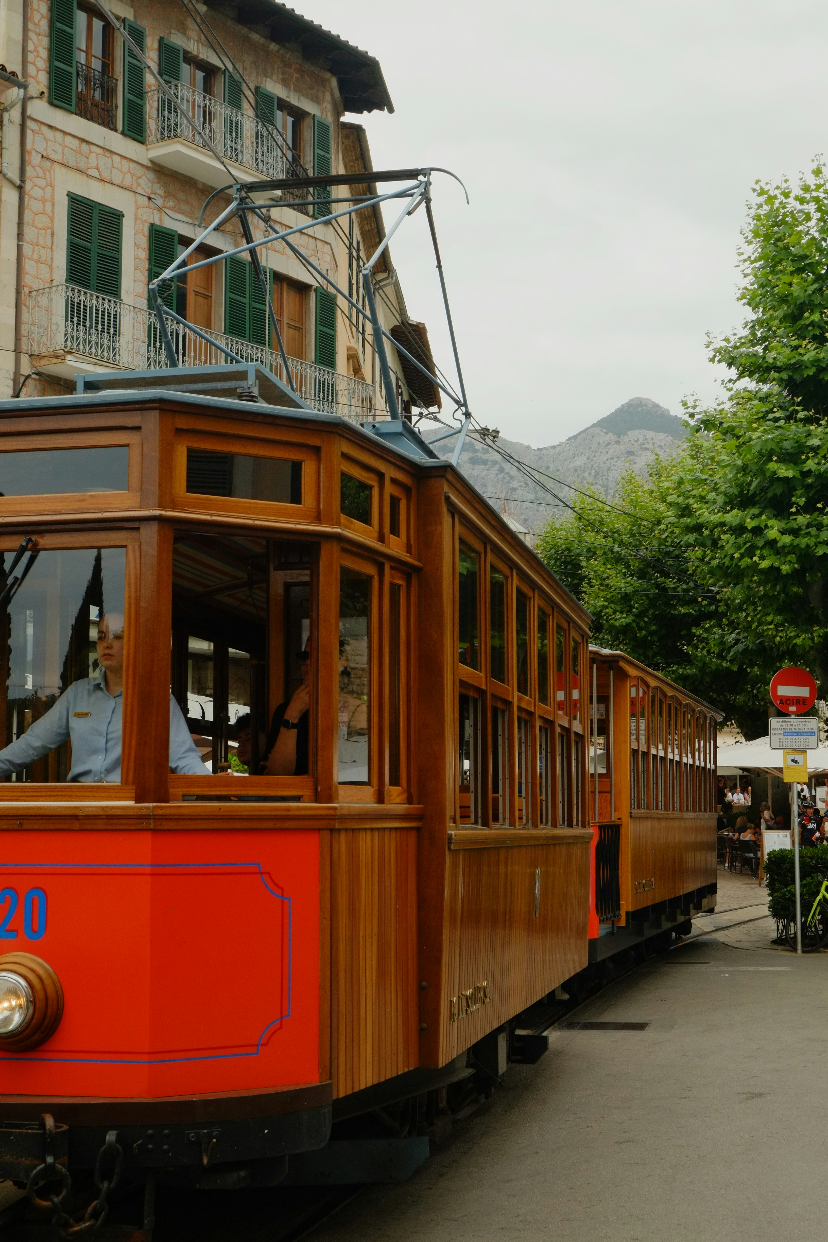 Vintage tram gliding through a mountain town