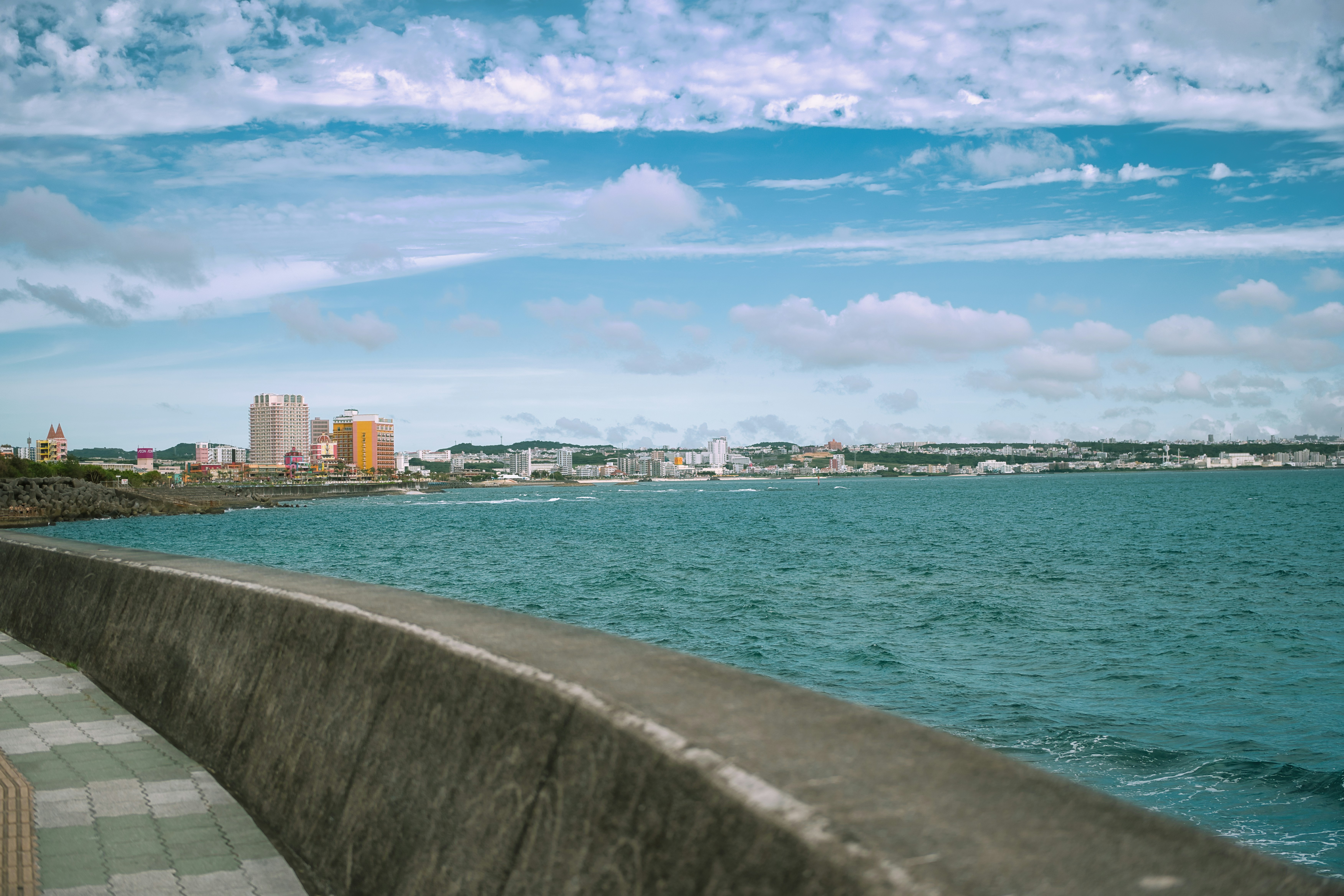 Coastline Promenade: Curved Sea Wall Framing a Quiet Harbor