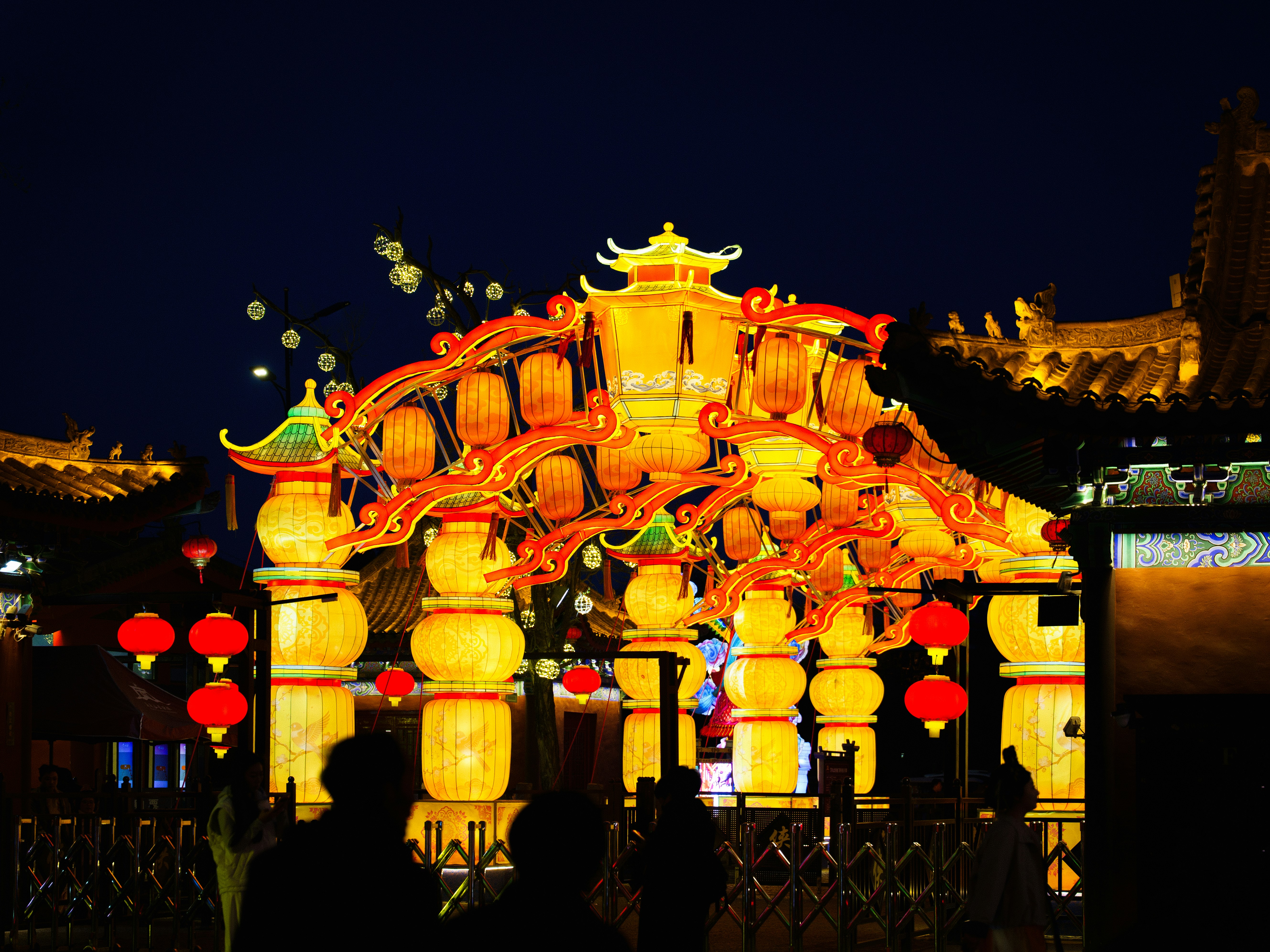 Lantern Gate at Night: Glowing Archway of Festive Lanterns
