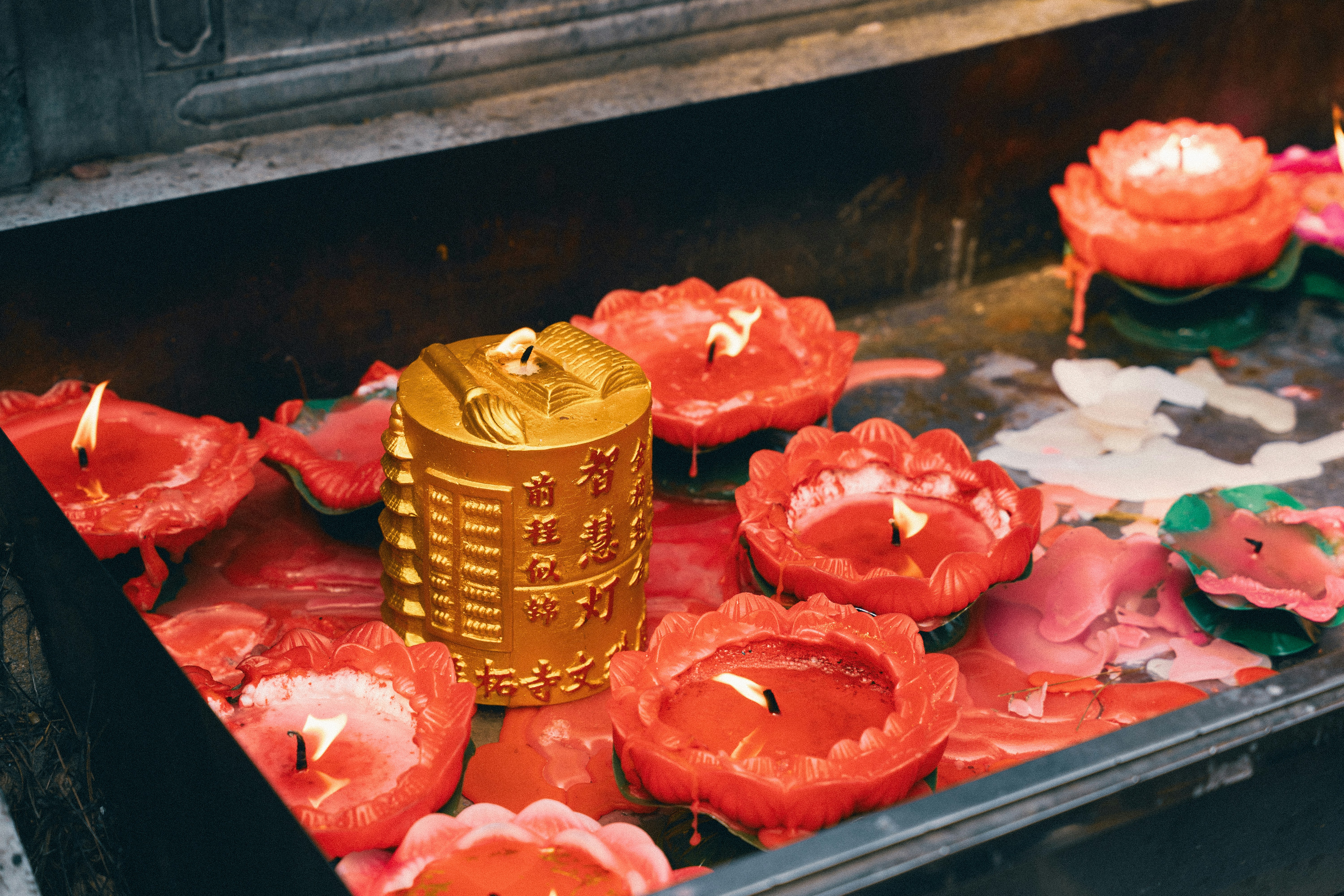 Golden Lantern Amid Red Floats: A Shrine of Candied Light
