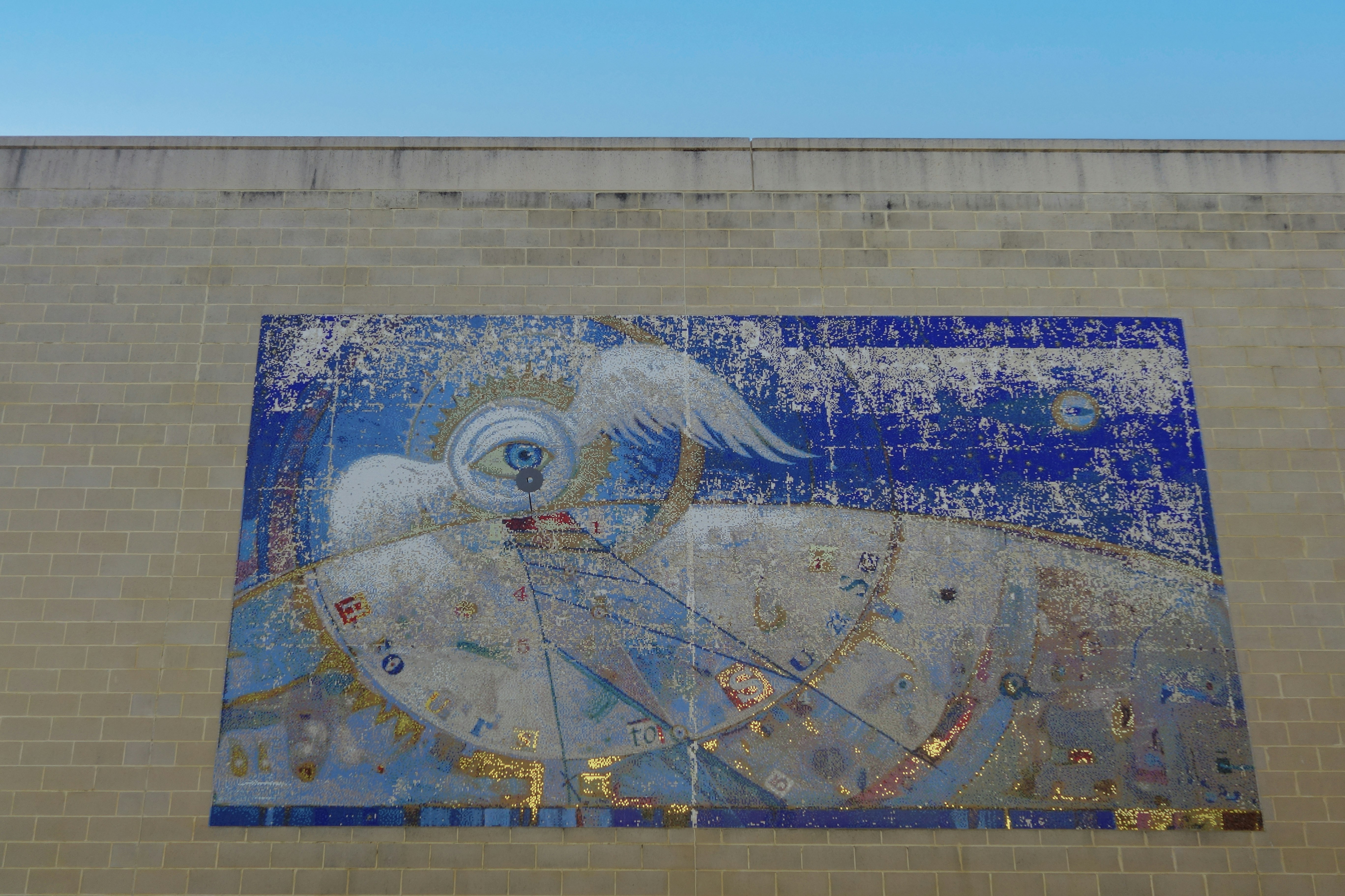 Angel of the Mosaic: Frayed Colors on a City Wall