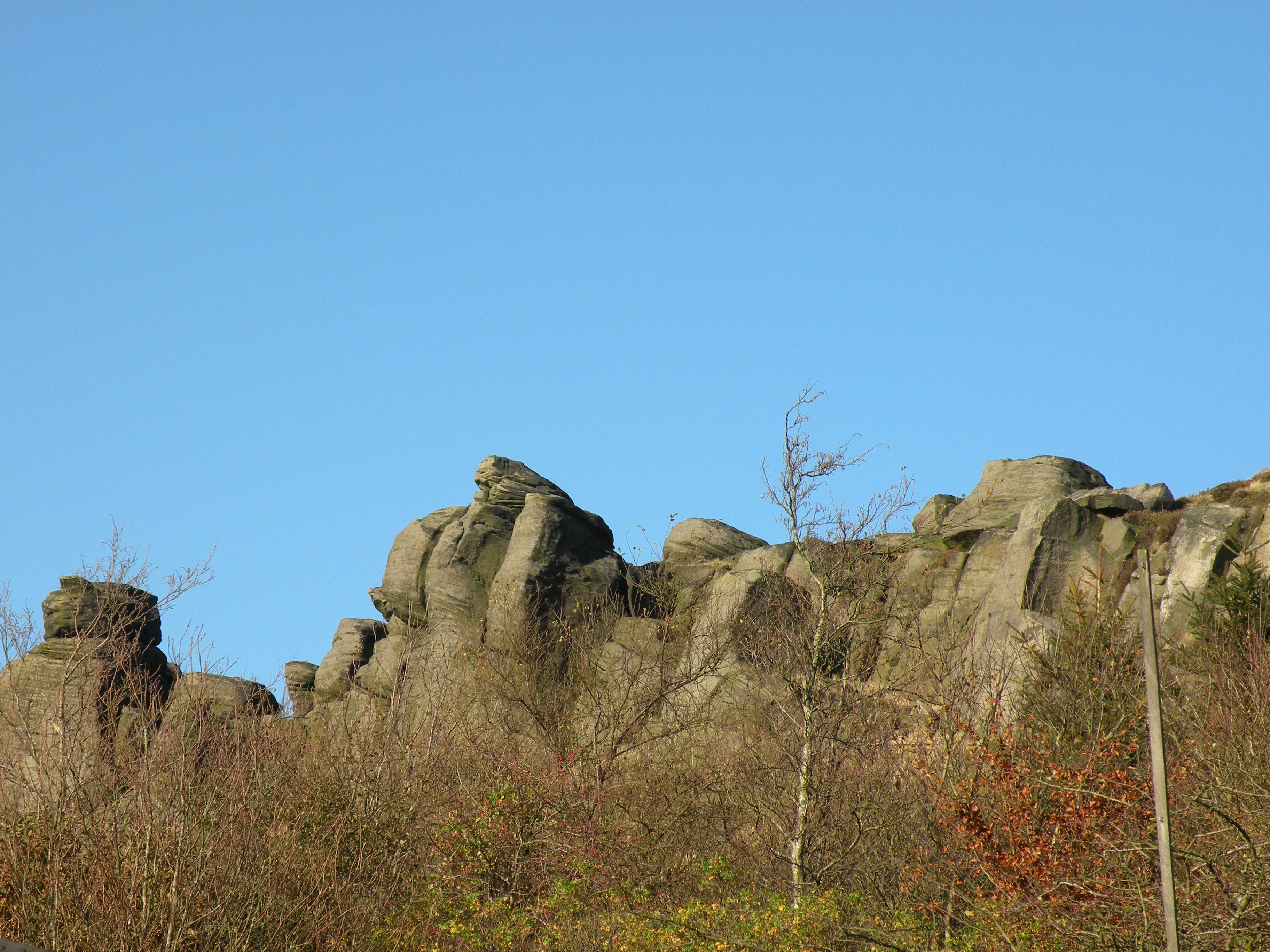Rugged Stone Skyline under a Clear Blue Vignette
