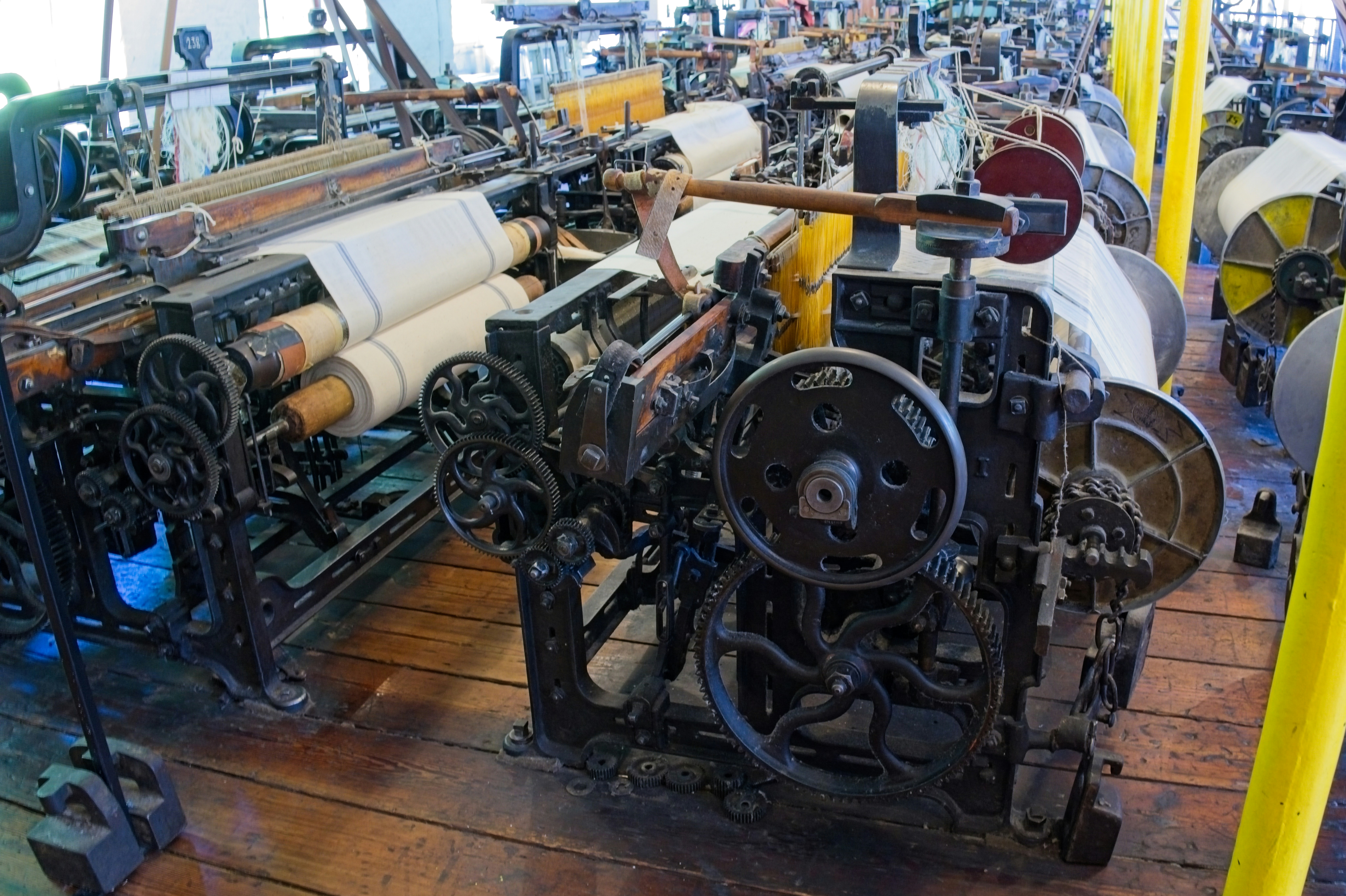 Rusted Machinery in a Loom Room: Chromed Gears and Wooden Floors
