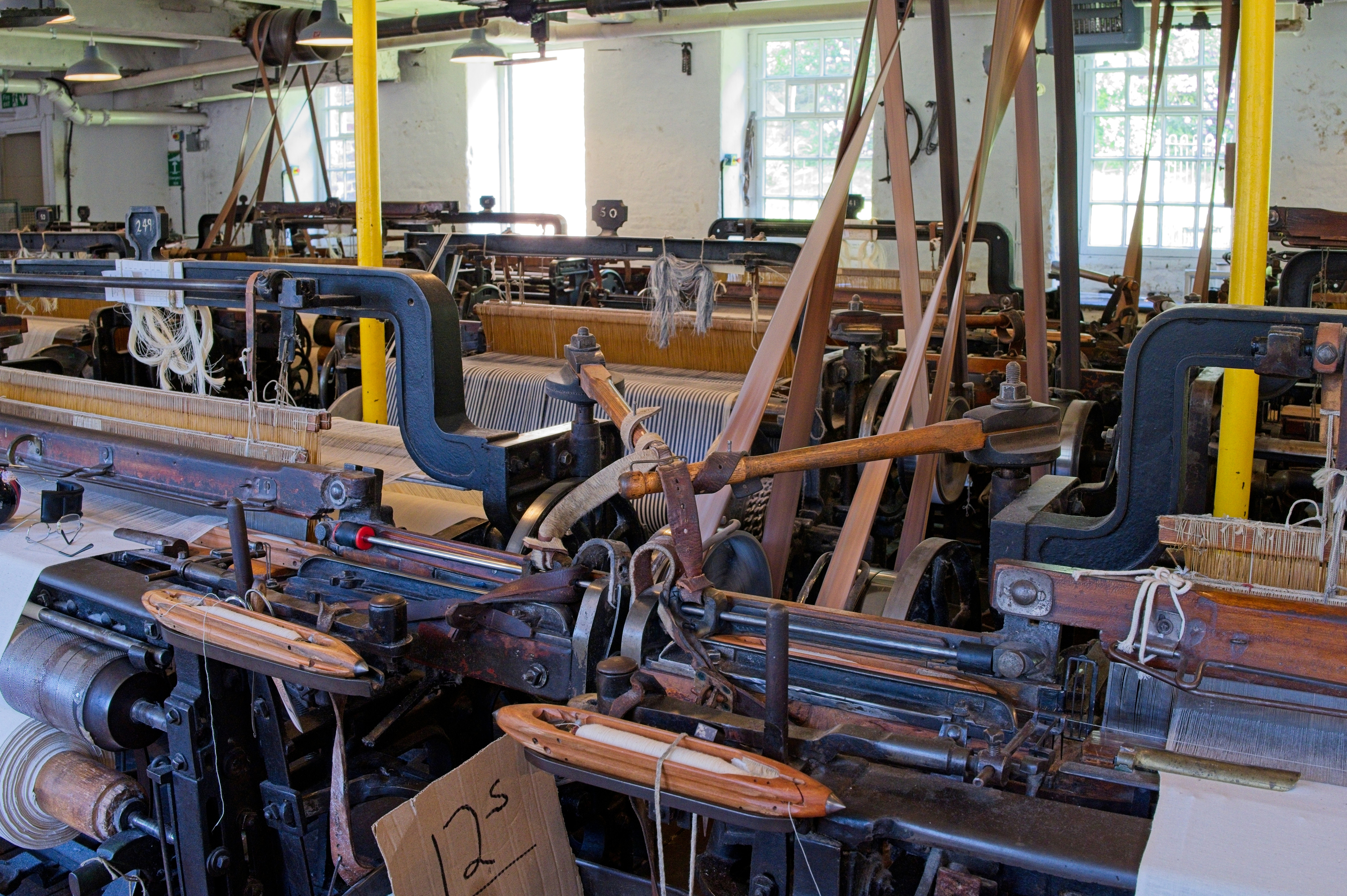 Industrial Looms: A Busy Textile Workshop Frozen in Steam and Steel
