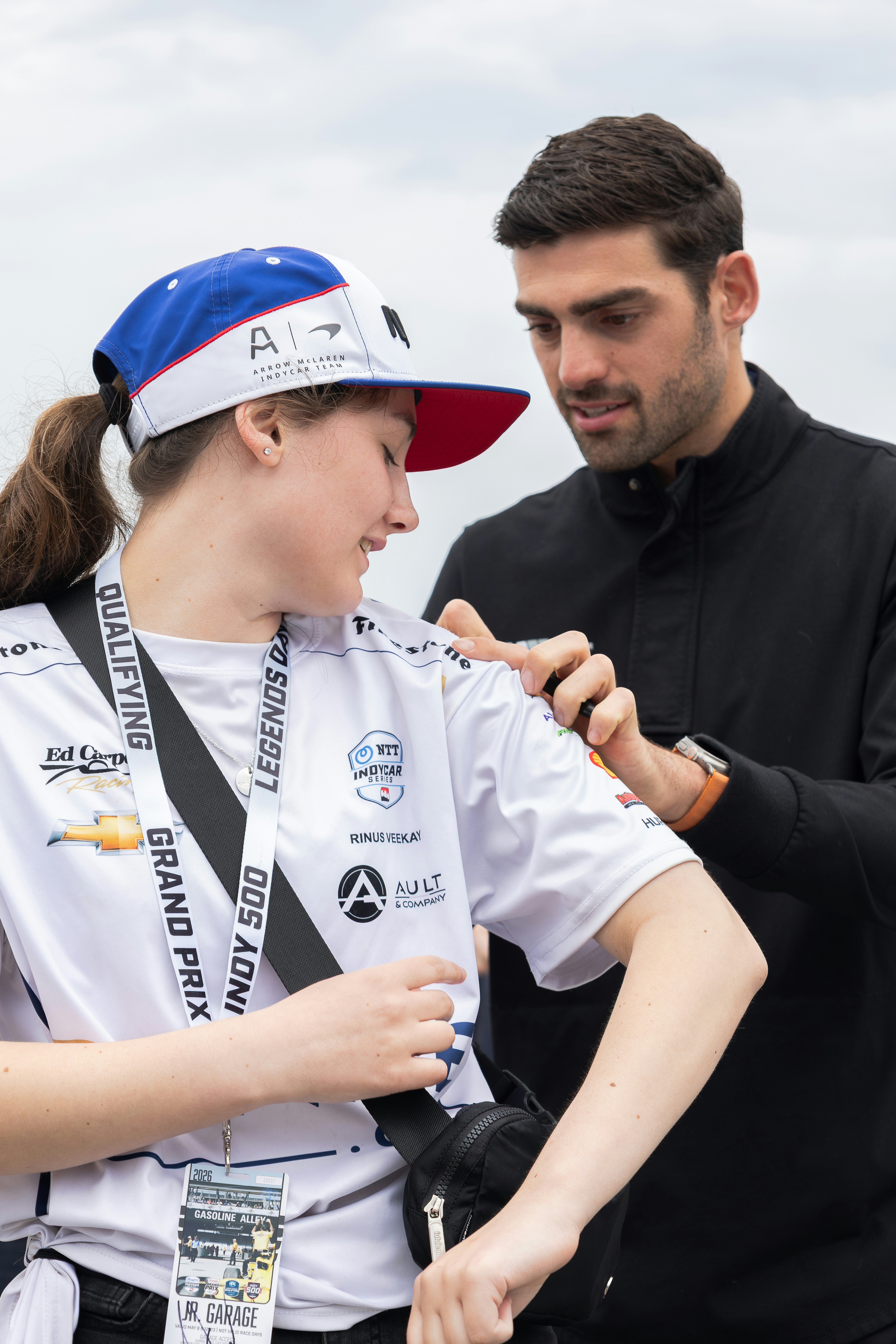 Focused Interaction: Coach Adjusts Champion’s Gear