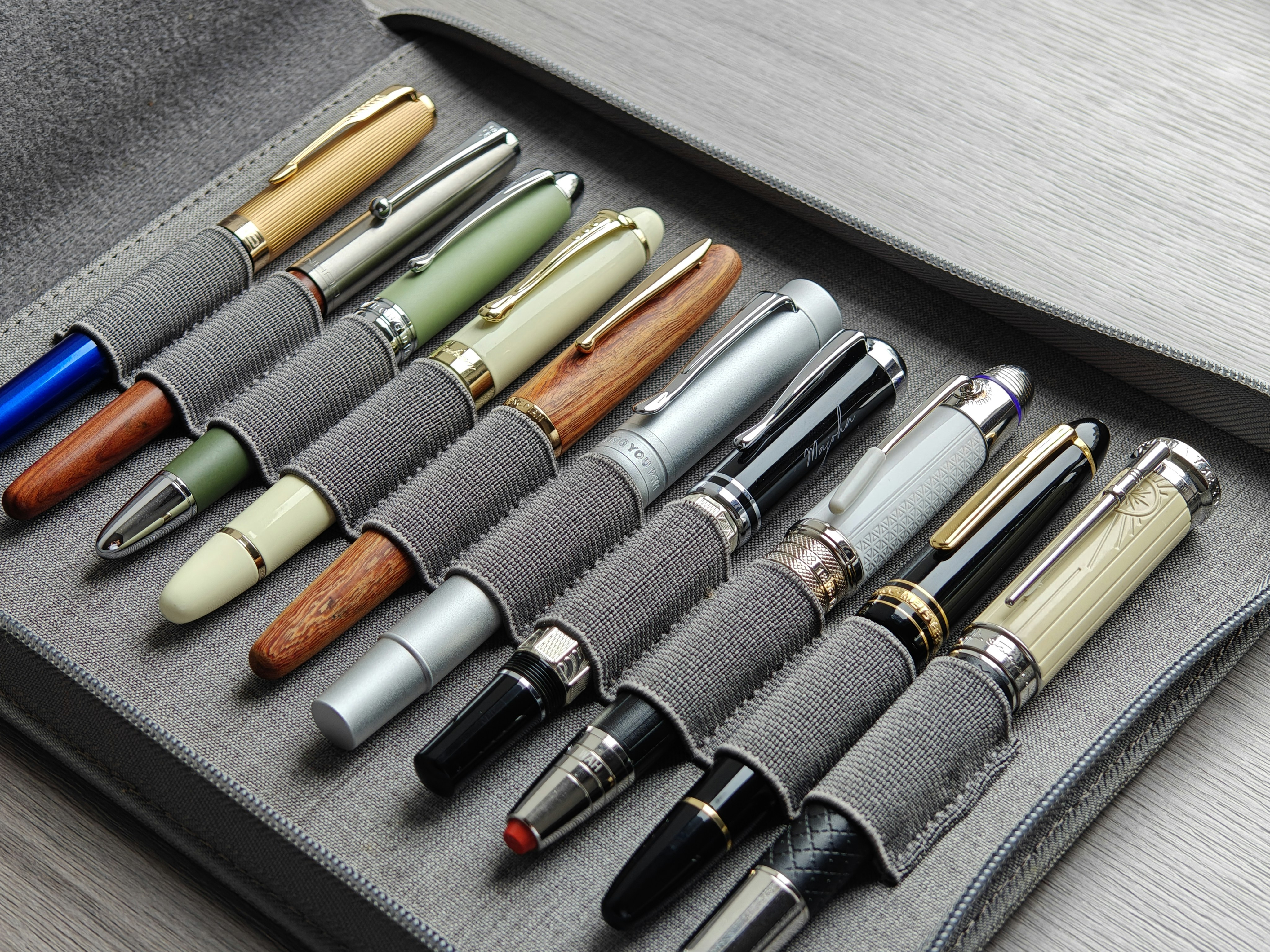 A Row of Elegant Fountain Pens in a Travel Case
