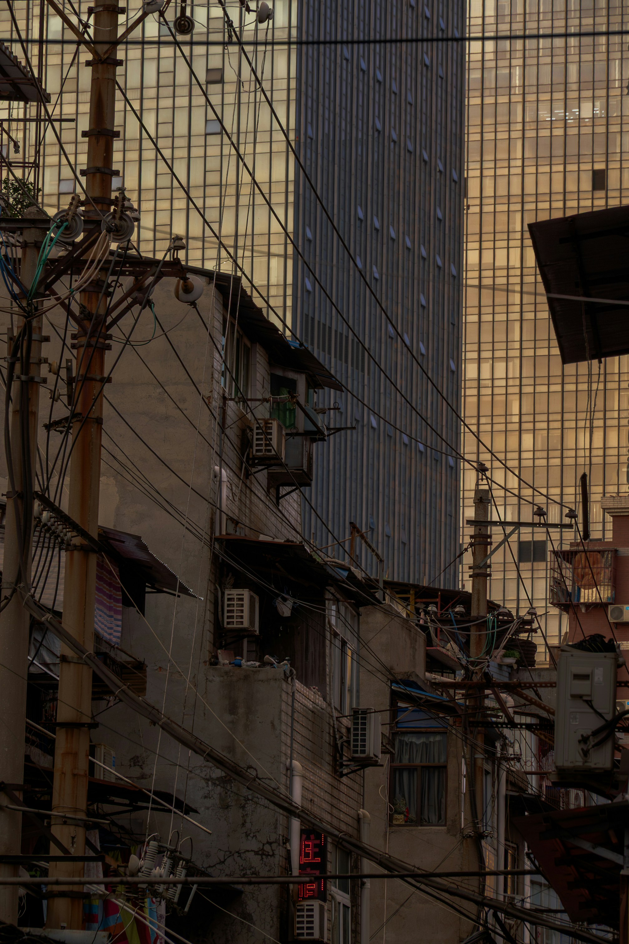 Tangled Cables Over a City Alley
