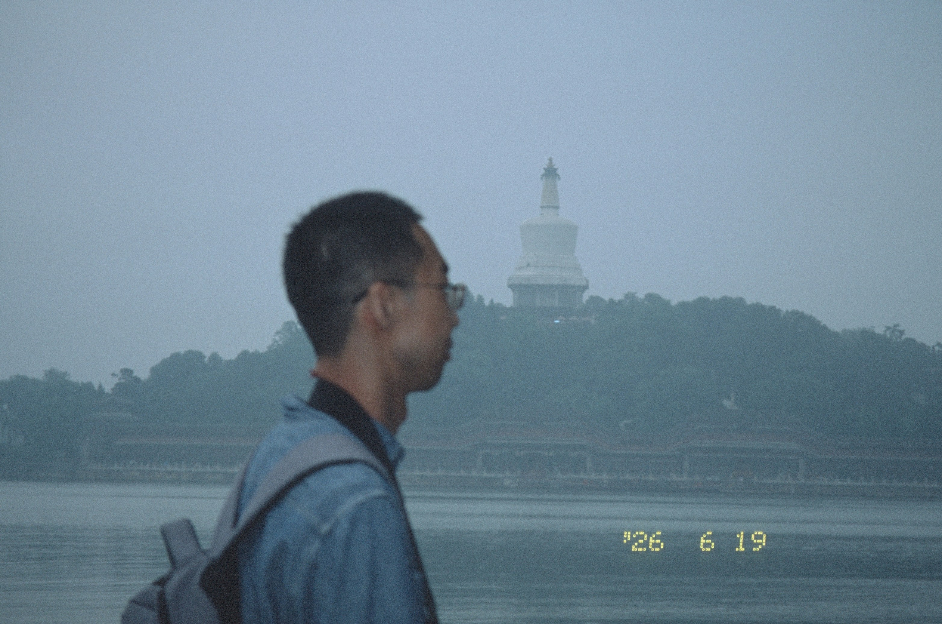 Traveler in the Mist: silhouette against a misty temple backdrop