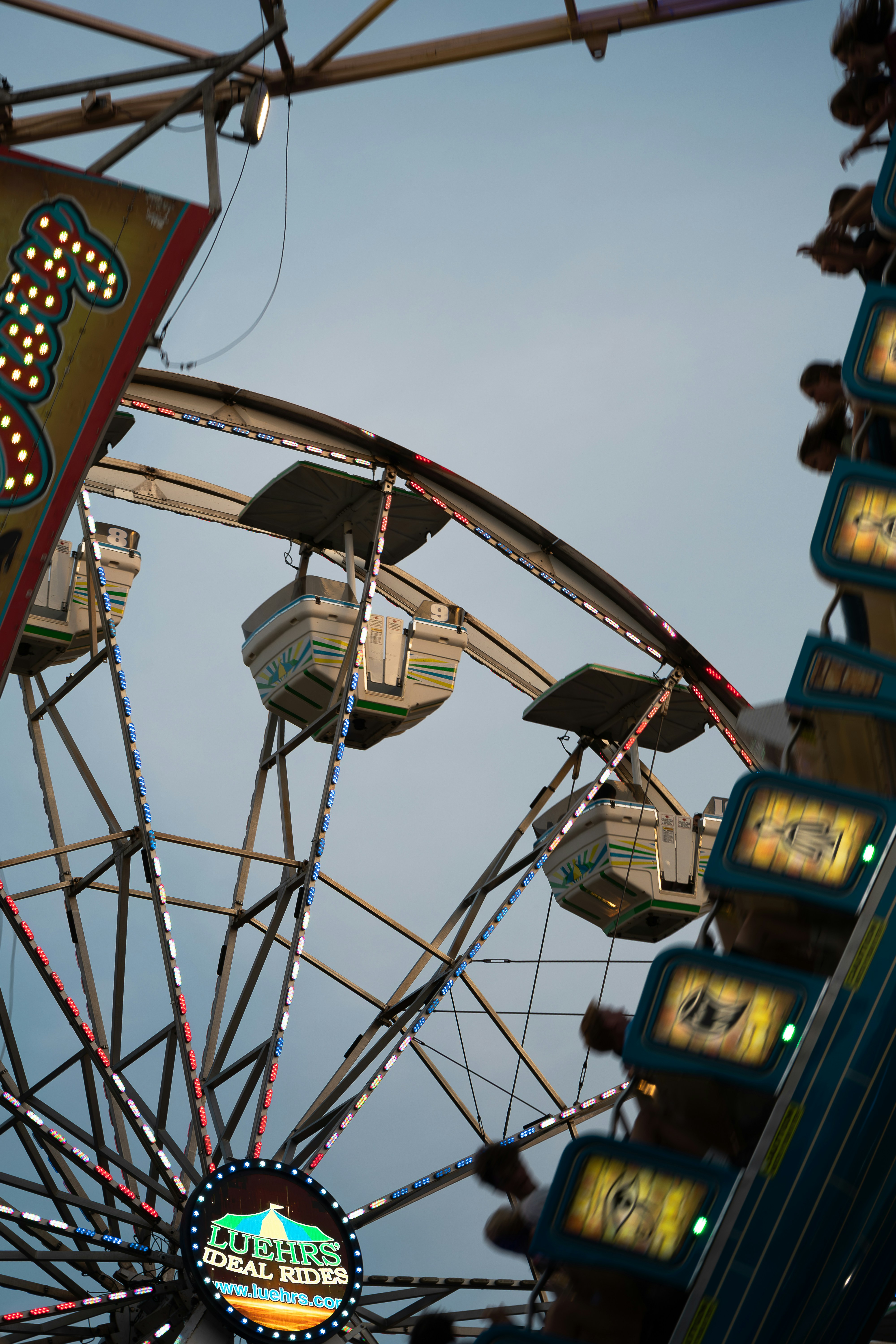 Ferris Wheel Echoes Over Neon Rails